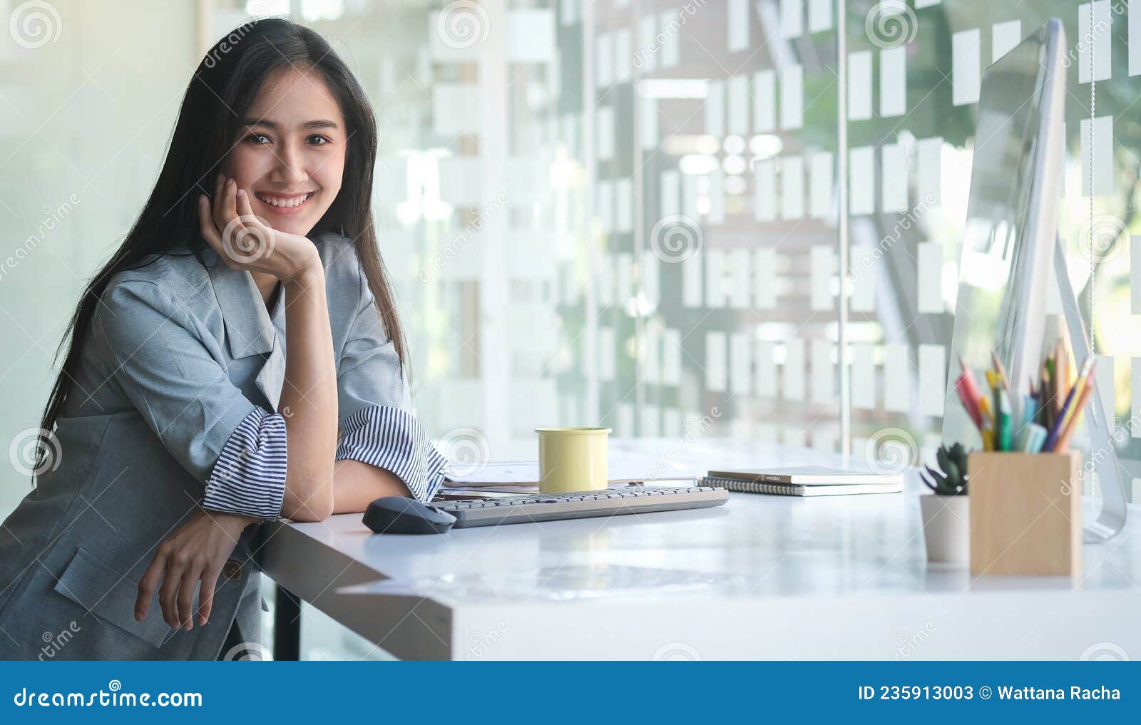 A Young Female Administrative Assistant Making Notes of Working ...