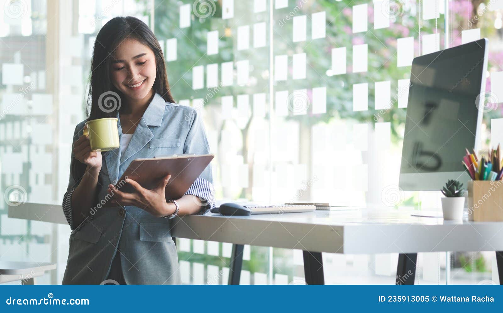 A Young Female Administrative Assistant Making Notes of Working ...