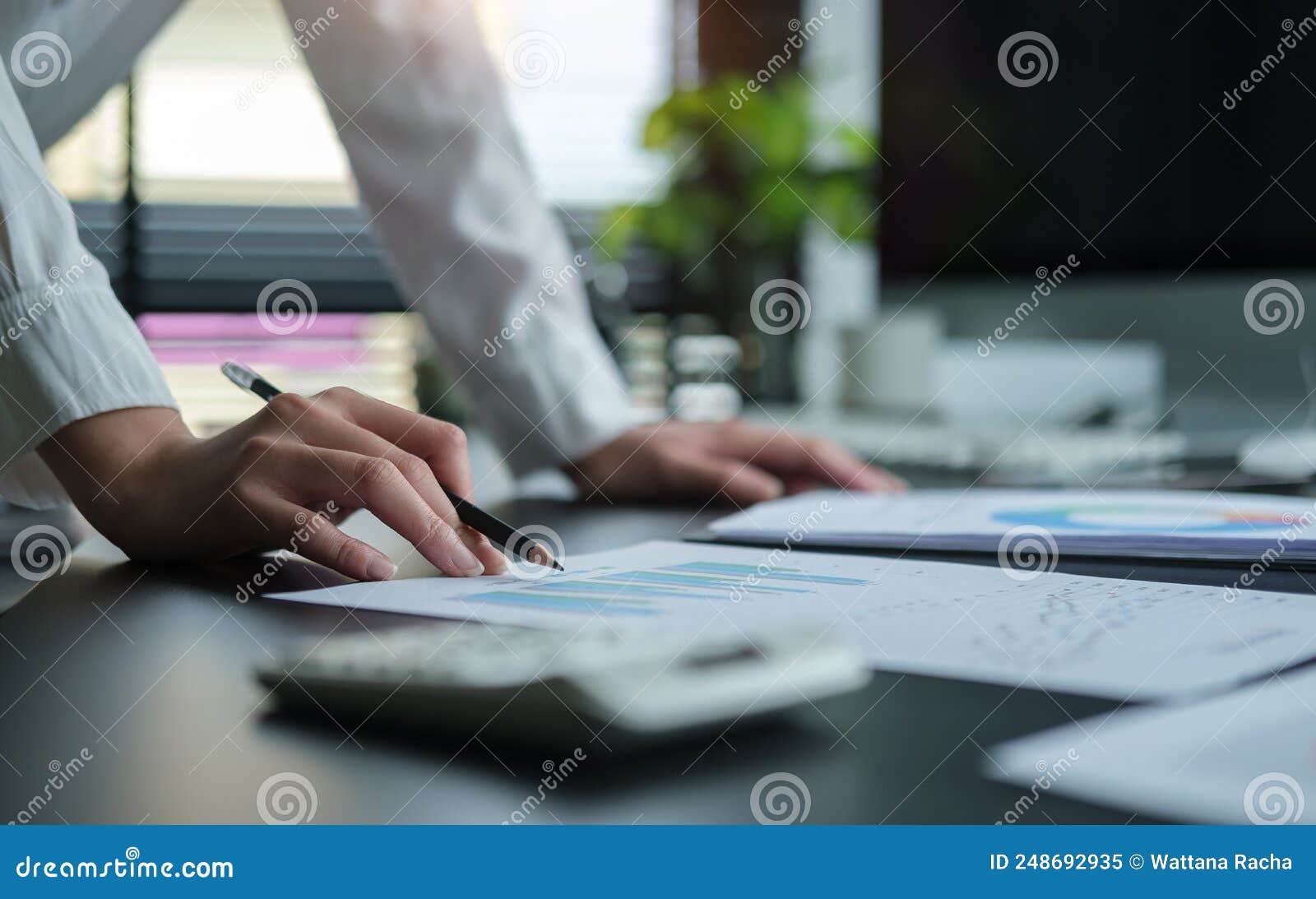 A Young Female Administrative Assistant Making Notes of Working ...