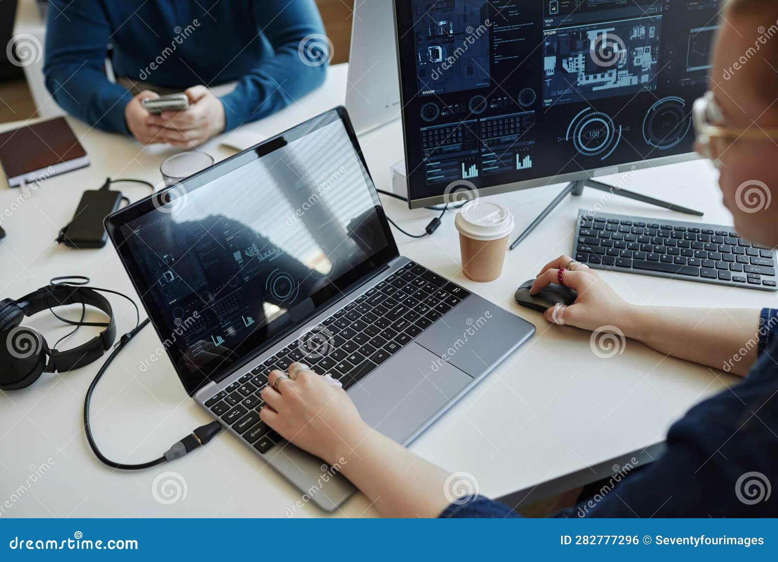 Young Female Analyst or it Manager Using Laptop while Sitting by ...