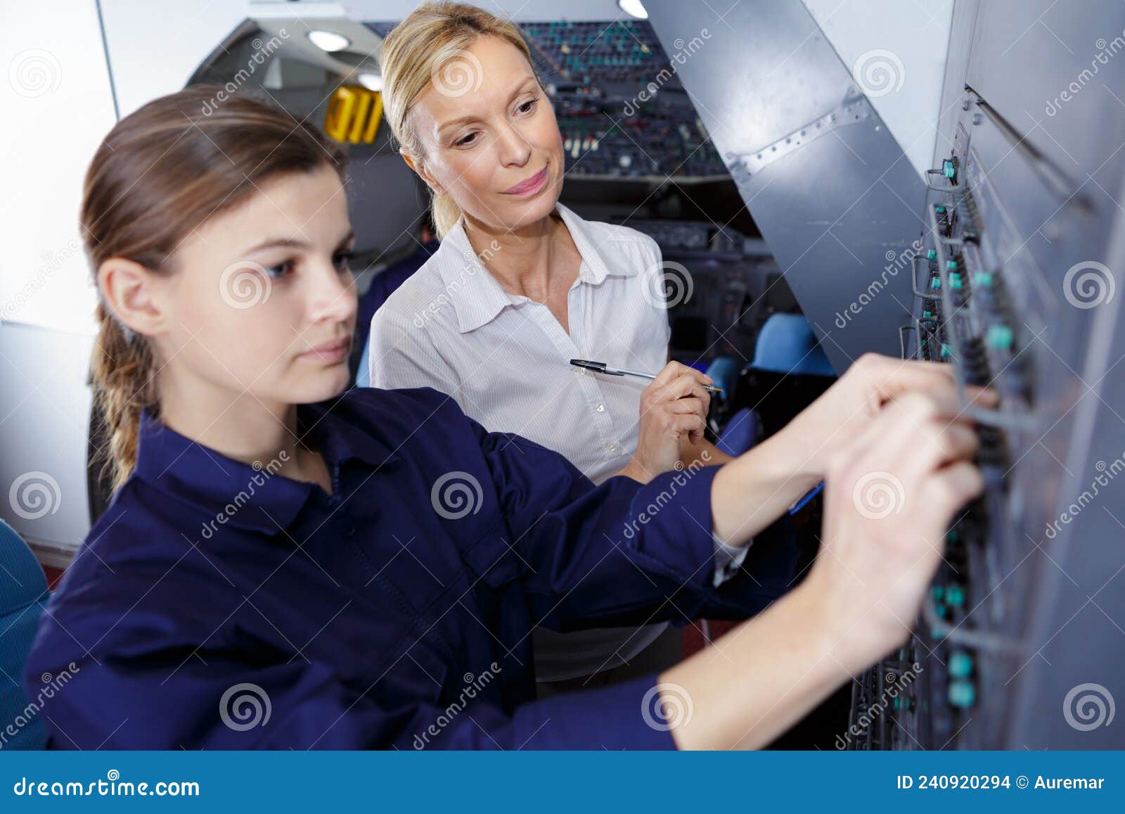 Young Female Apprentice Electrician with Instructor Stock Photo - Image ...