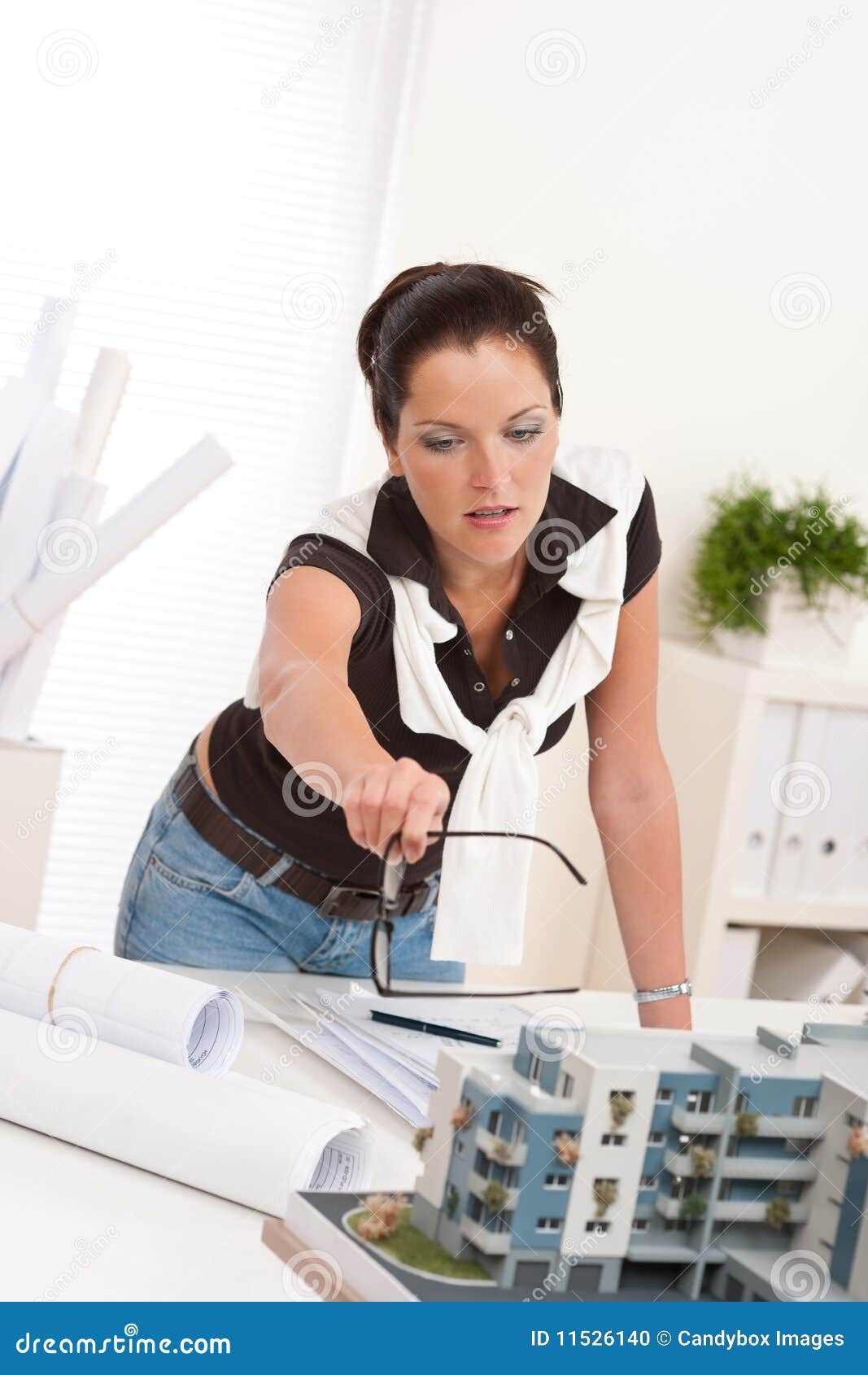 Young Female Architect with Architectural Model Stock Photo - Image of ...