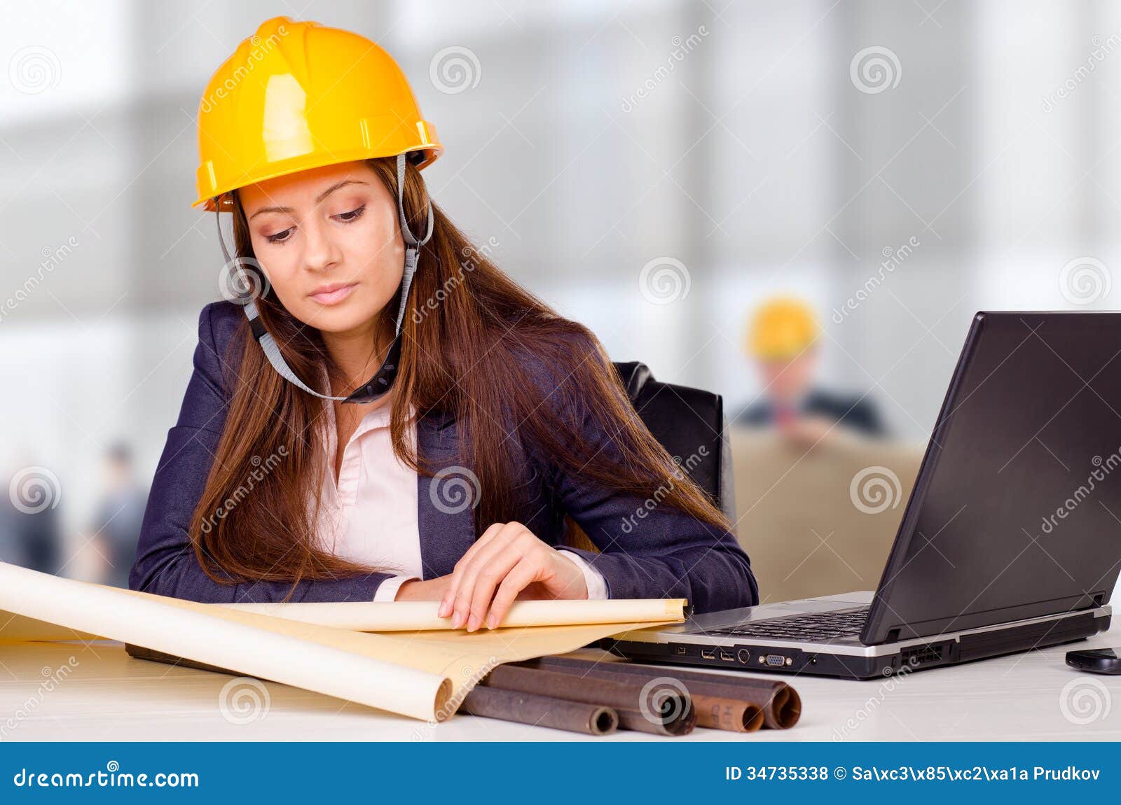 Young Female Architect Studying Plans Stock Photo - Image of ...