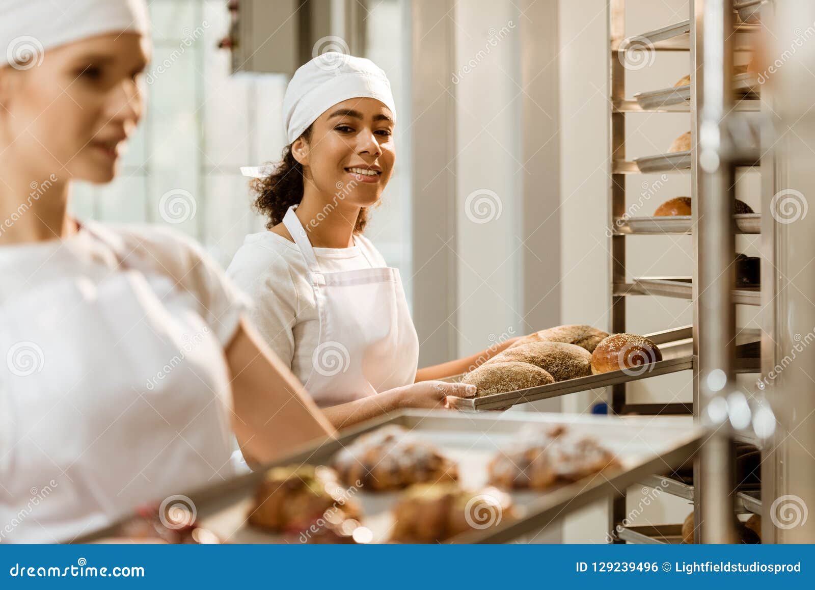 Young Female Bakers Working Together Stock Photo - Image of coworkers ...