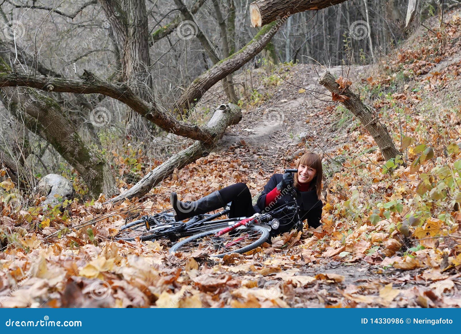 Young Female Bicycle Rider Down Smiling Stock Photo - Image of brunette ...