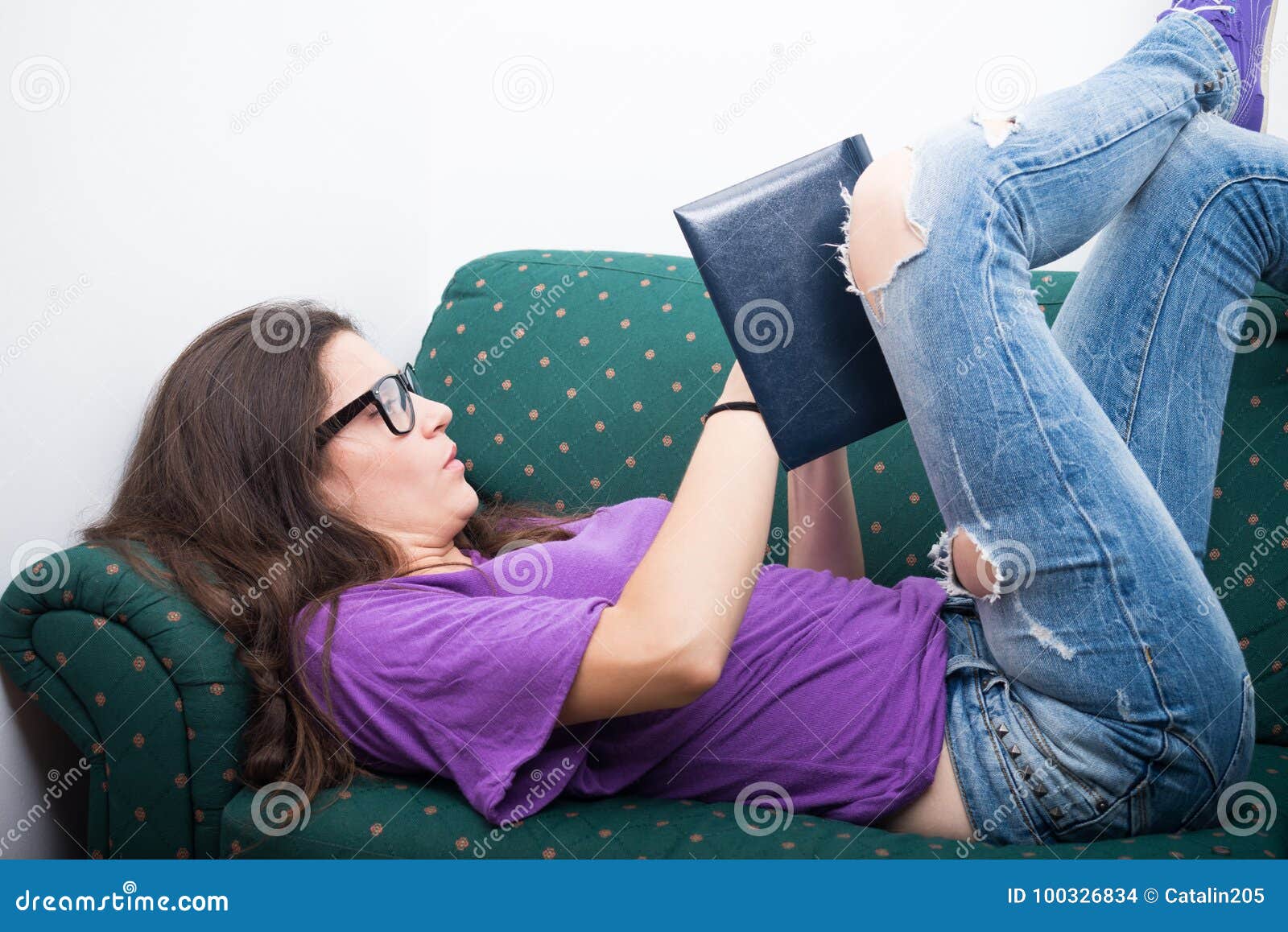 Young Female with Book Reading on the Sofa Stock Photo - Image of calm ...