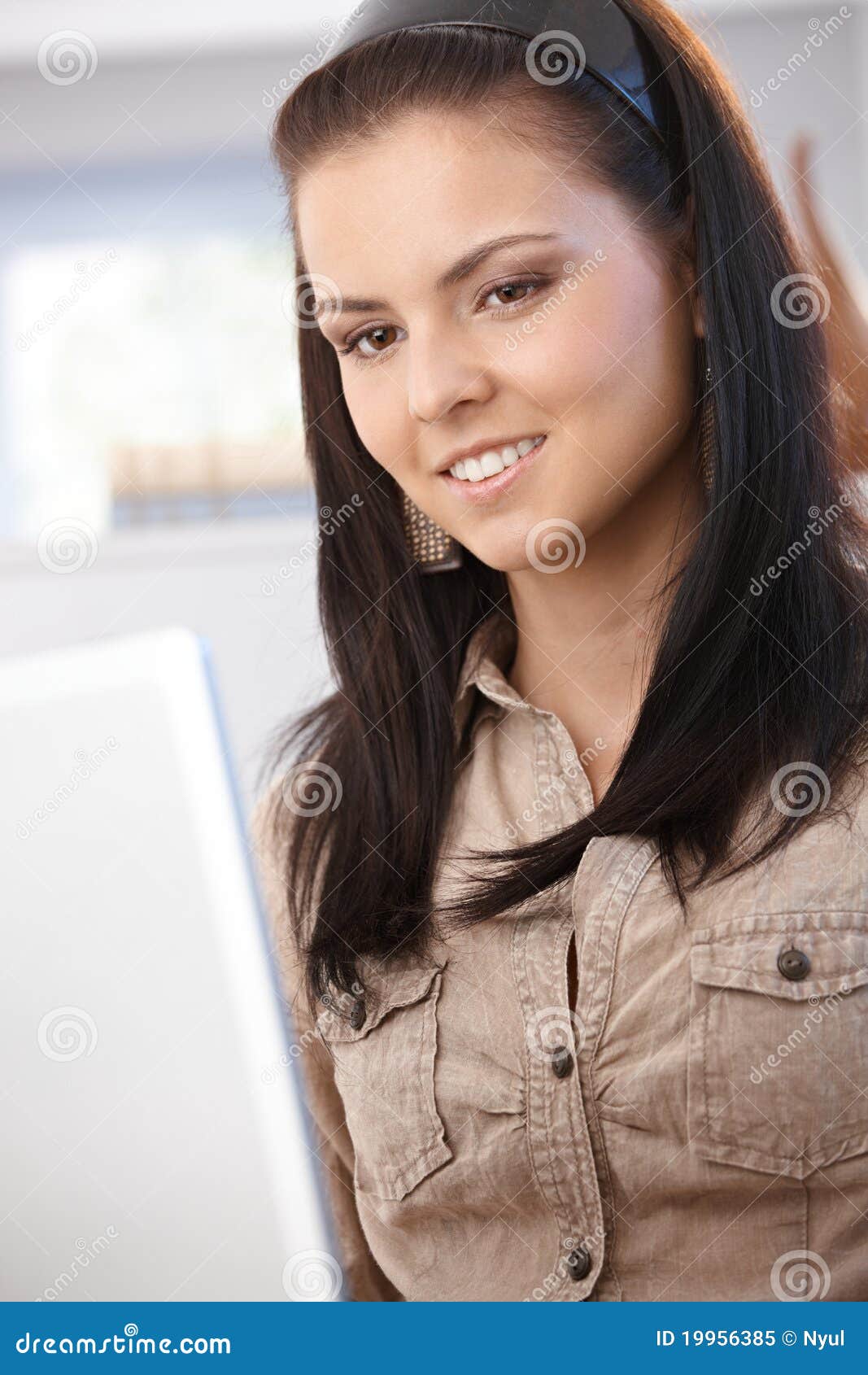Young Female Browsing Internet on Laptop Smiling Stock Image - Image of ...
