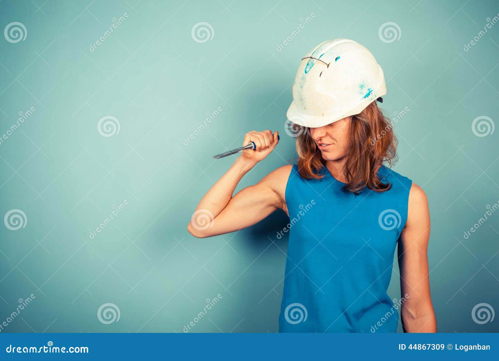 Young Female Builder Holding a Chisel Aggresively Stock Image - Image ...