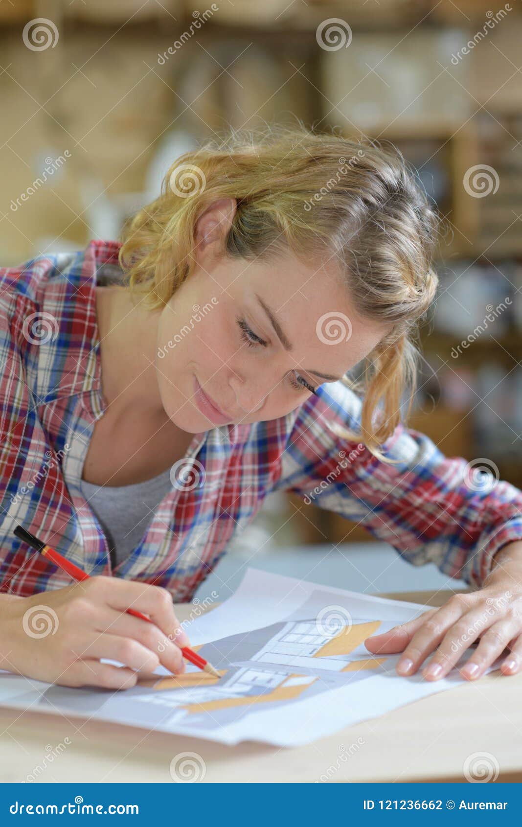 Young Female Carpenter Writing on Document in Workshop Stock Photo ...