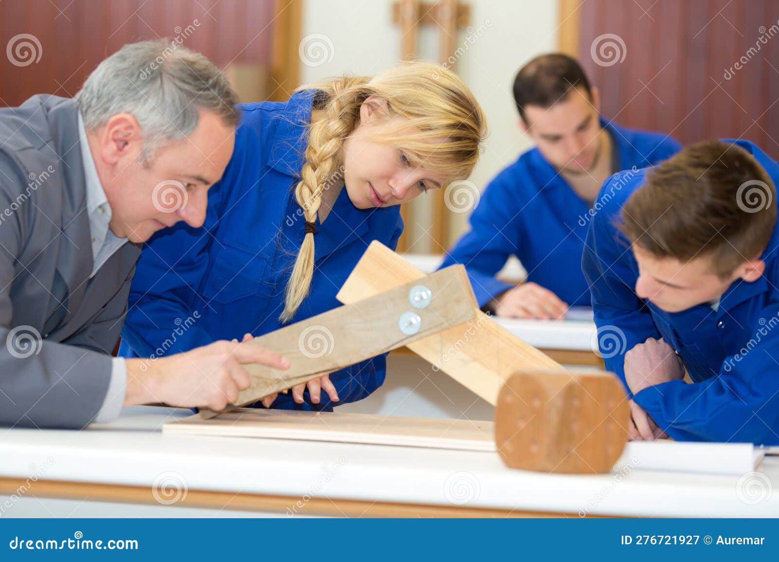 Young Female Carpenters Measuring Wood in Workshop Stock Image - Image ...