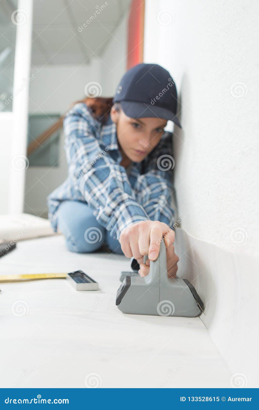 Young female carpet fitter stock image. Image of installing - 133528615