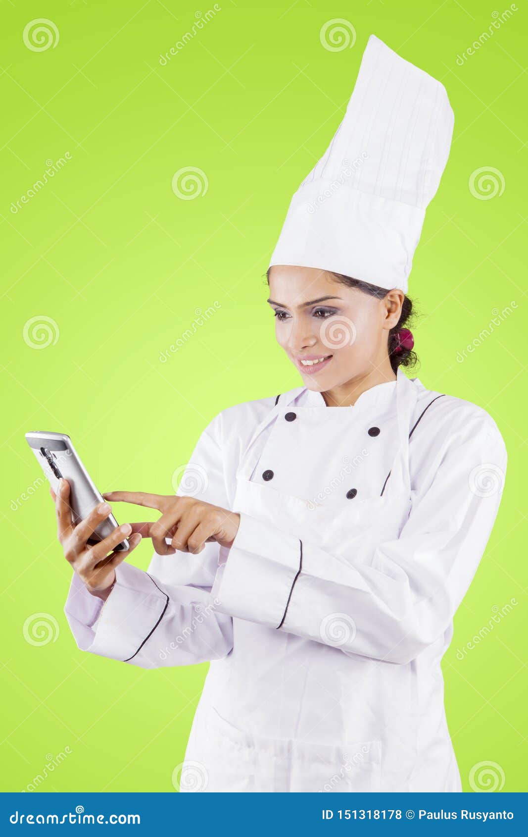 Young Female Chef Using a Phone on Studio Stock Photo - Image of ...