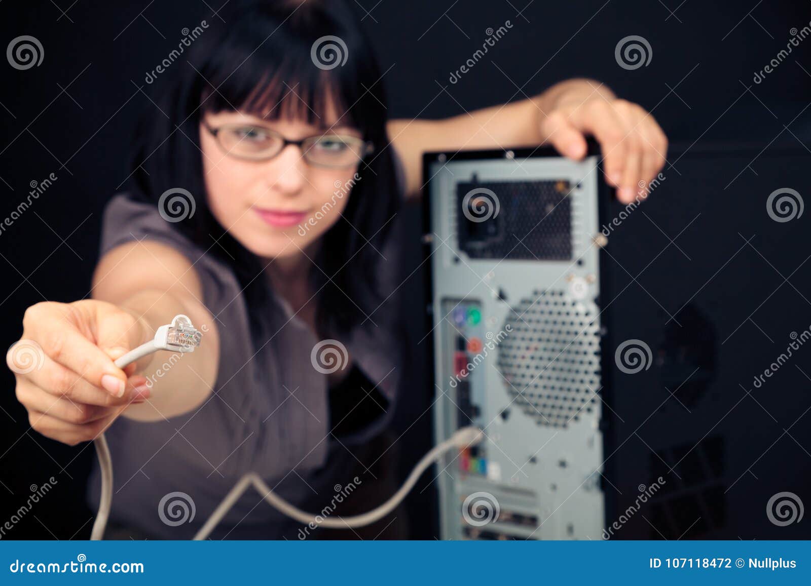 Young Woman Connecting a Network Cable Stock Photo - Image of ...