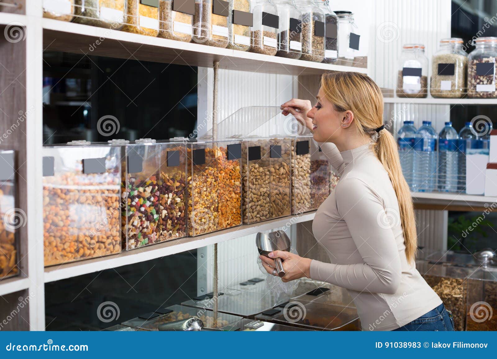 Young Female Customer Selecting Various Nuts Stock Image - Image of ...