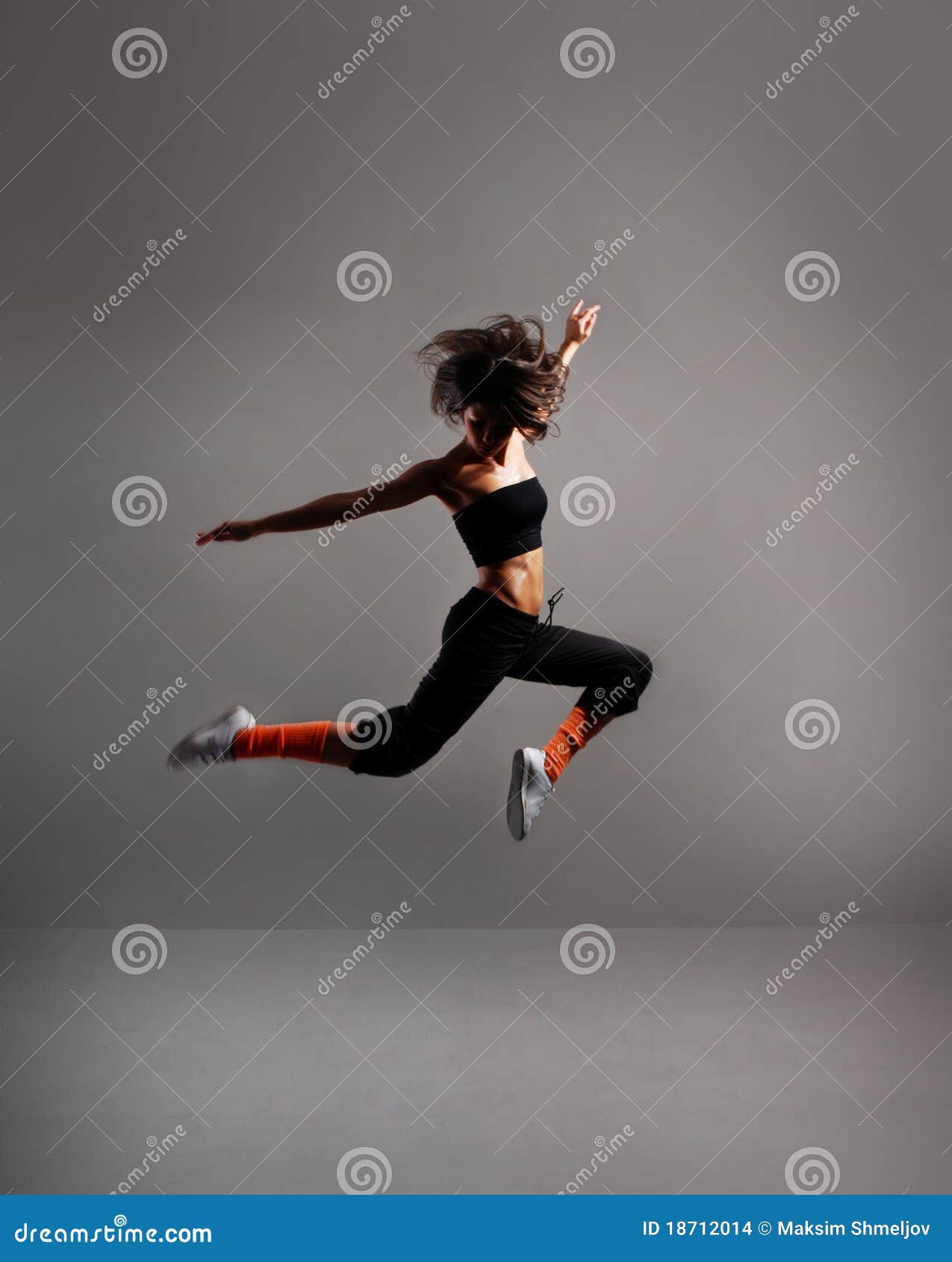 A Young Female Dancer is Performing a Jump Stock Photo - Image of grace ...