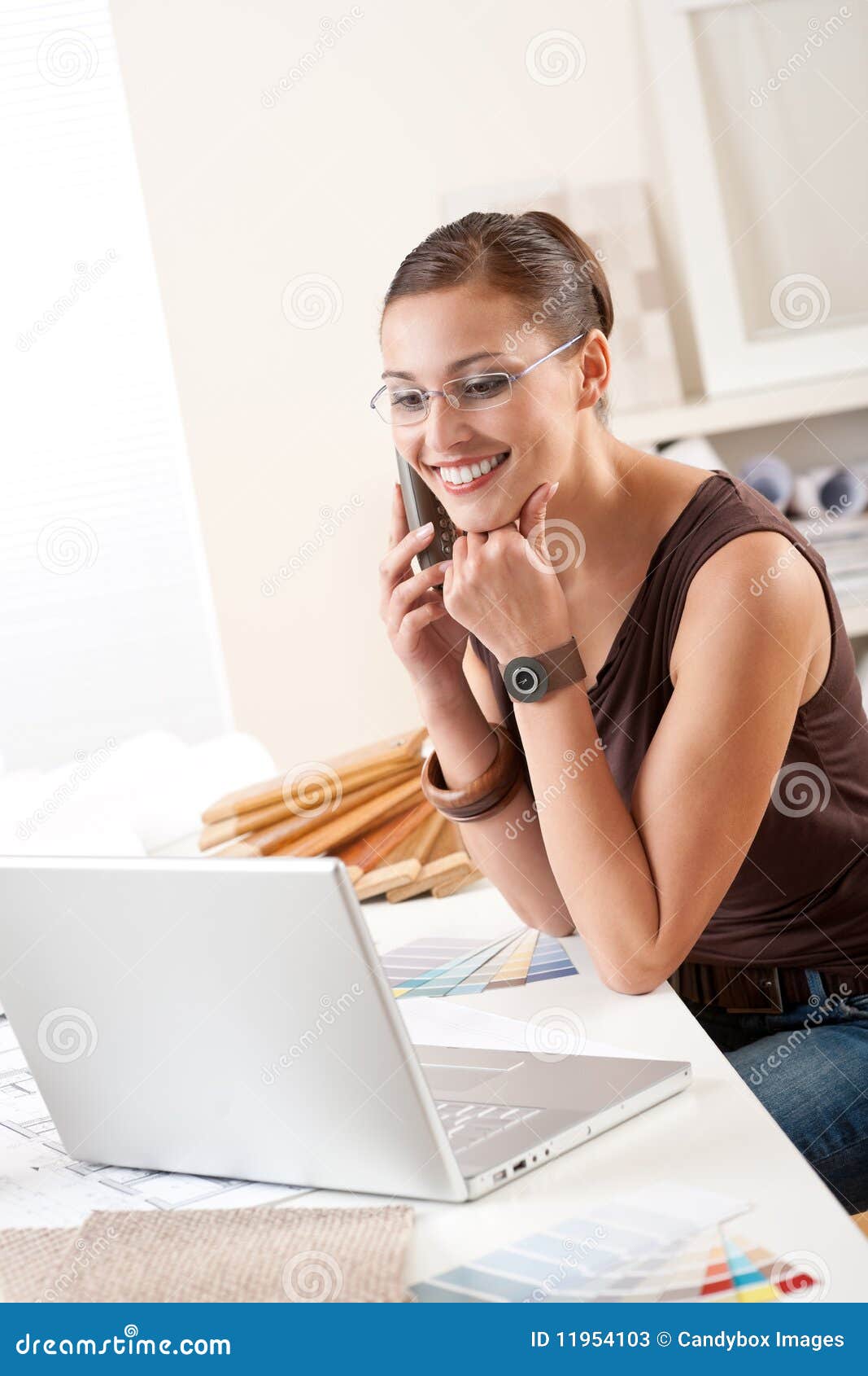 Young Female Designer on the Phone with Laptop Stock Image - Image of ...