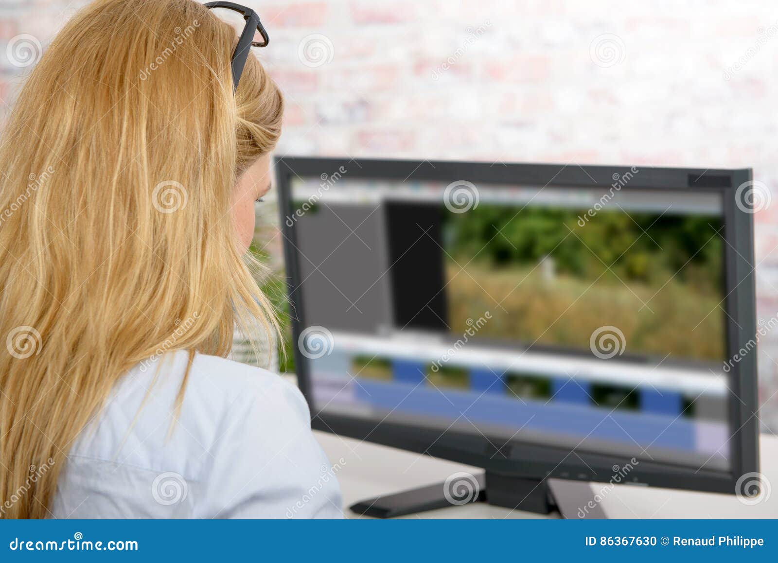 Young Female Designer Using Computer for Video Editing Stock Photo ...