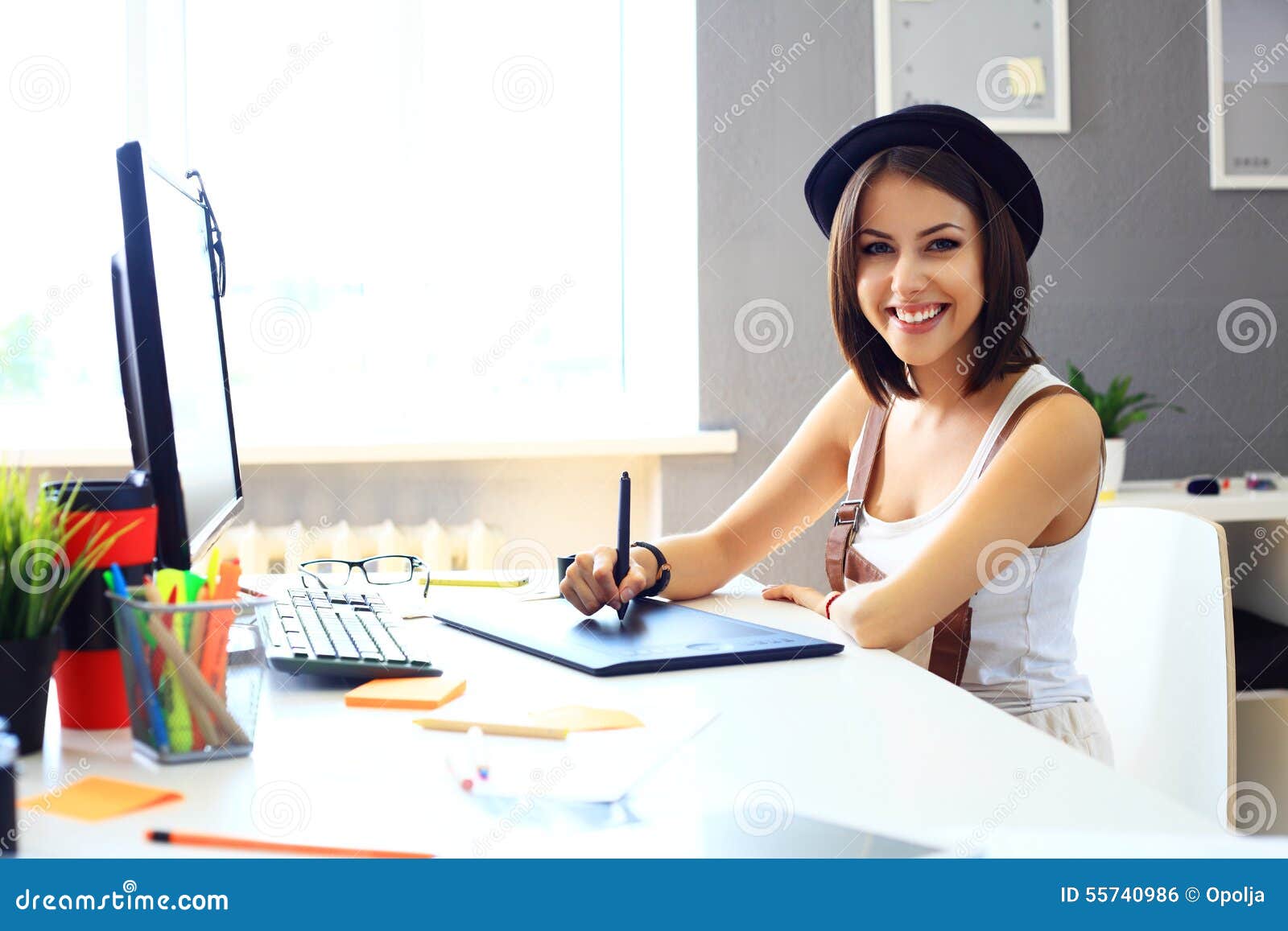 Young Female Designer Using Graphics Tablet while Working Stock Photo ...