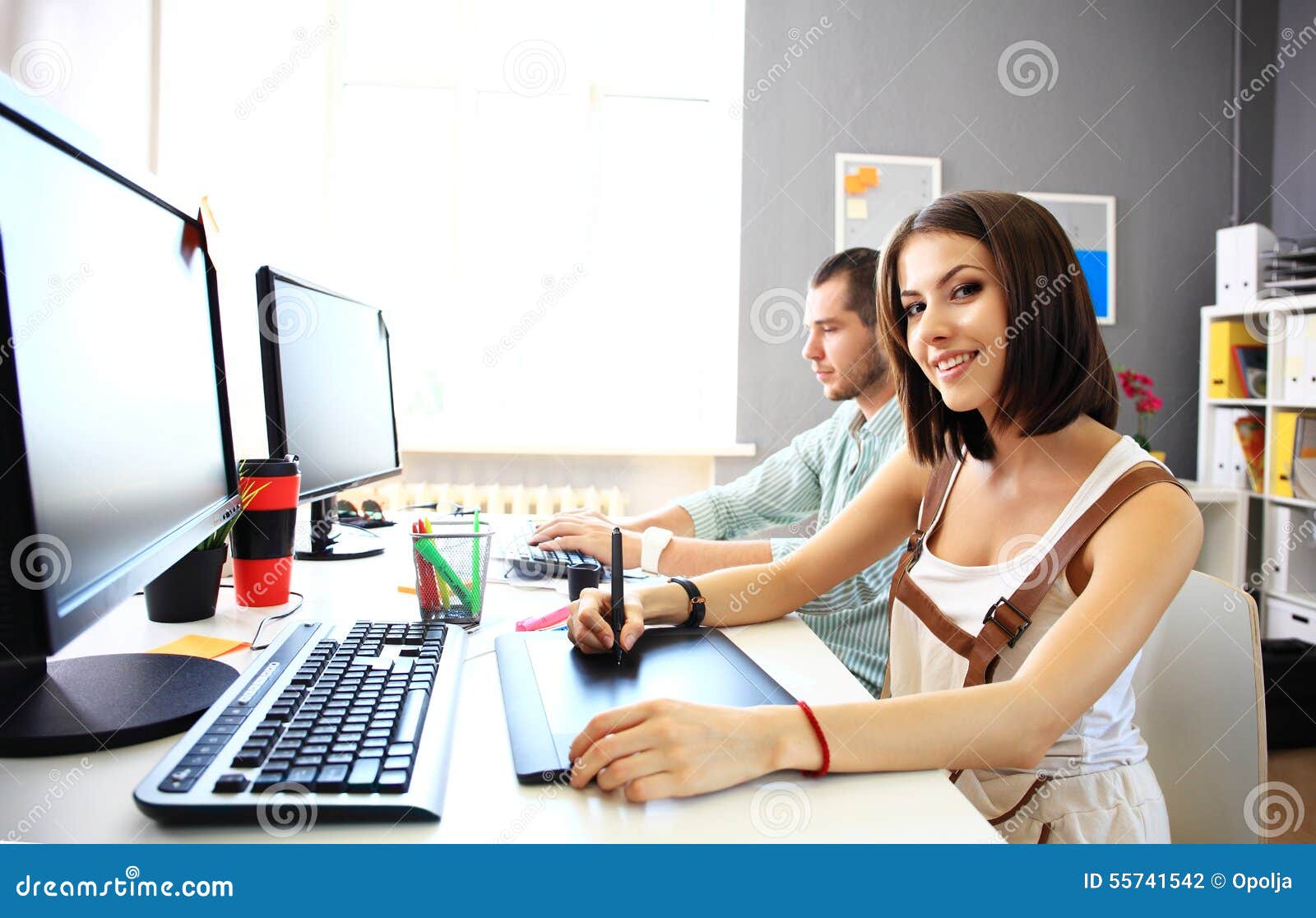 Young Female Designer Using Graphics Tablet while Working Stock Photo ...