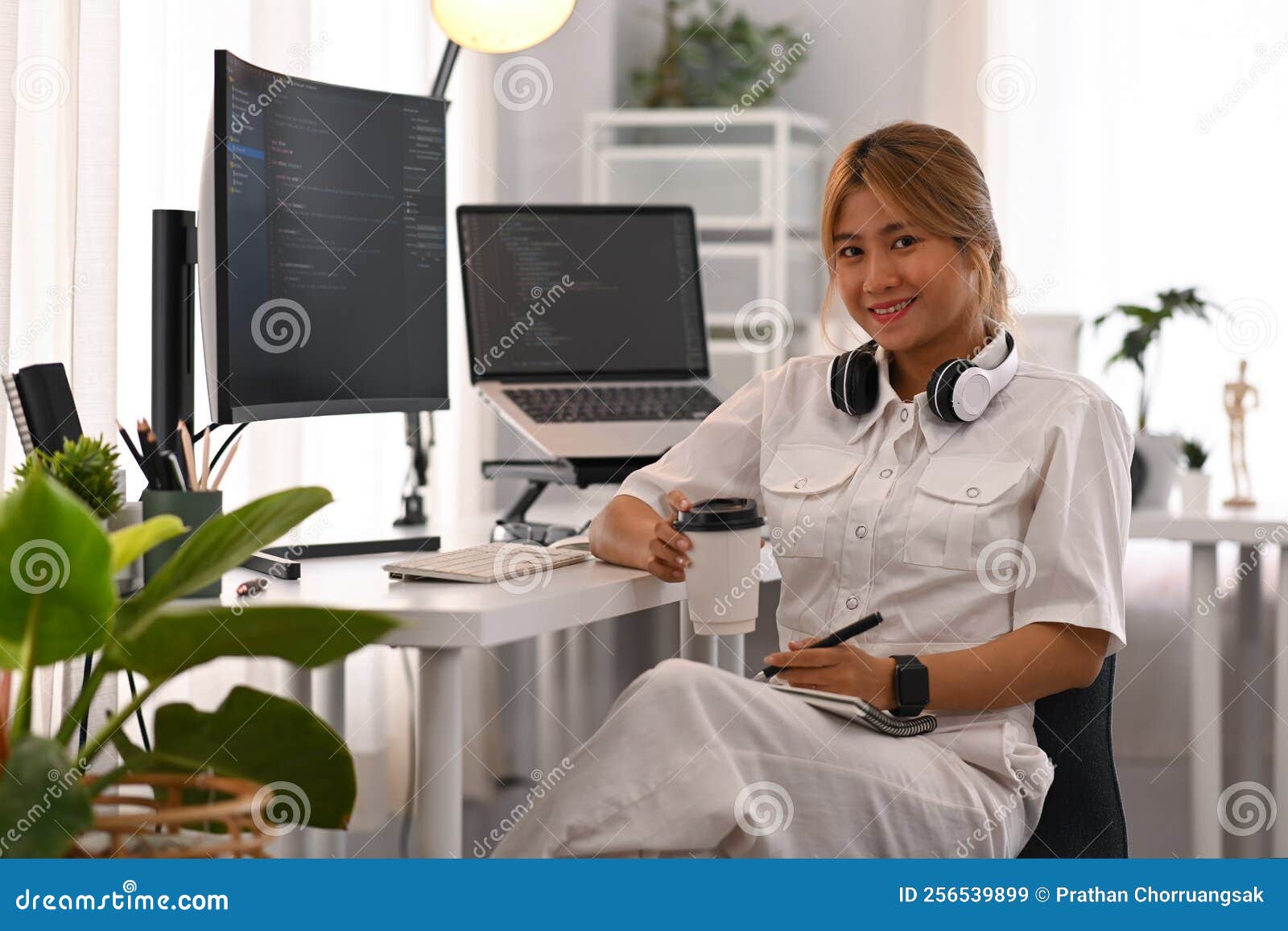 Young Female Developer Sitting Front of Computers with Coded Data on ...