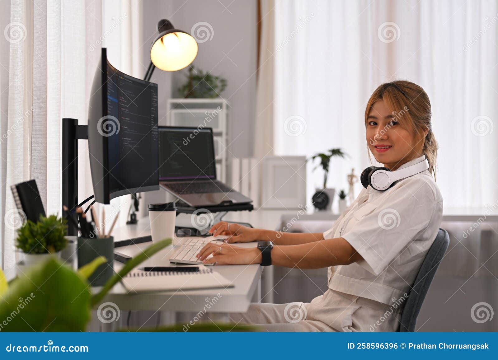 Young Female Developer Working with Coded Data on Computer Screen. Developing Programming and ...