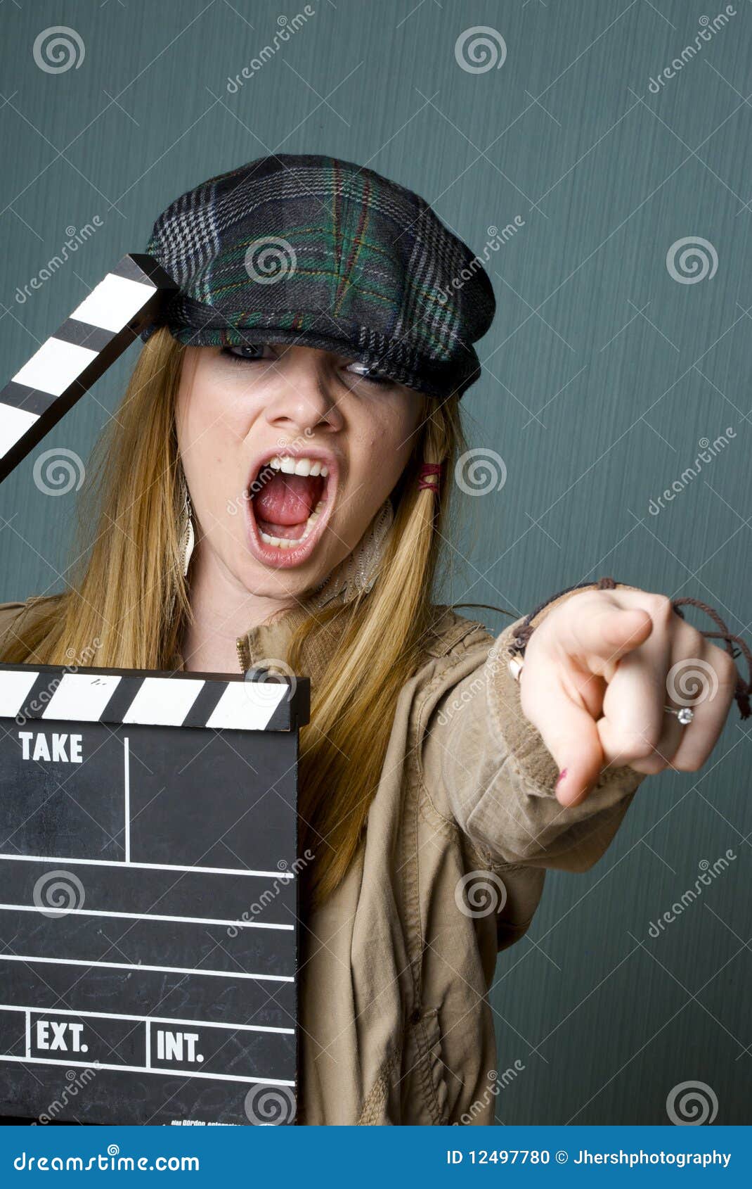 Young Female Director with Slate Pointing Stock Photo - Image of niches ...