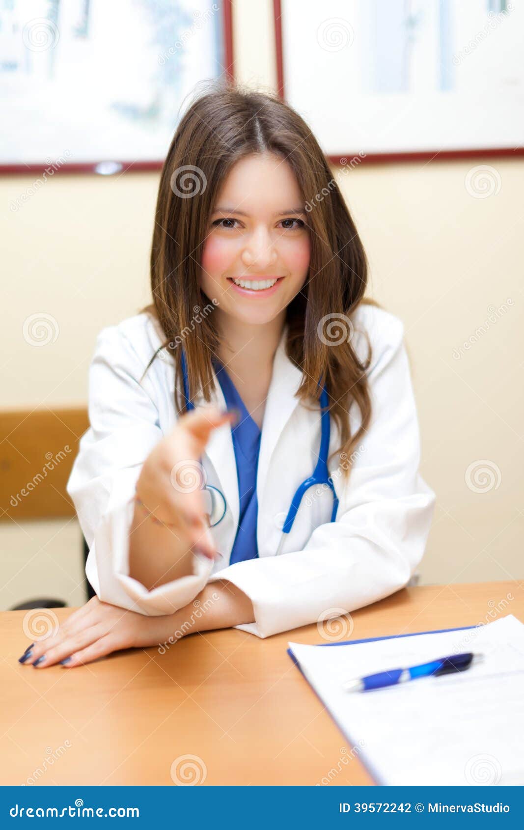 Young Female Doctor Giving Her Hand Stock Photo - Image of doctoring ...