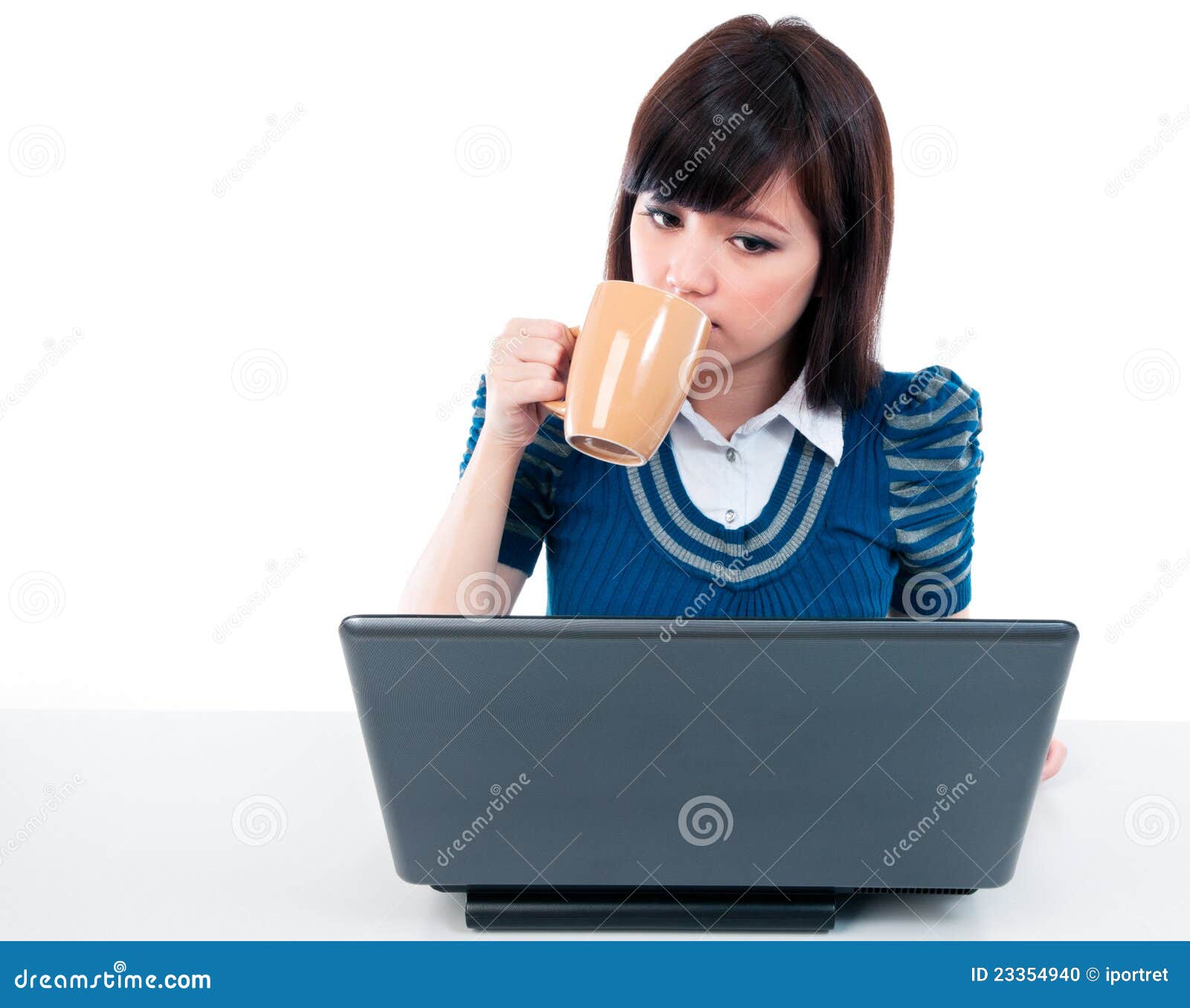 Young Female Drinking and Looking at Laptop Stock Photo - Image of ...