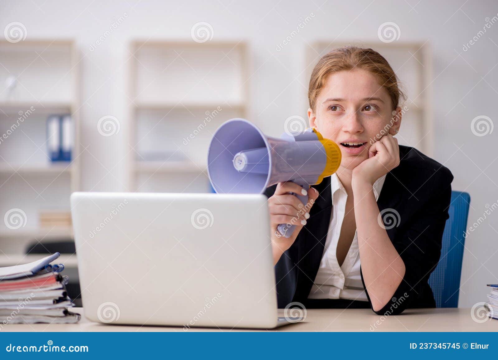 Young Female Employee Holding Megaphone in the Office Stock Image ...