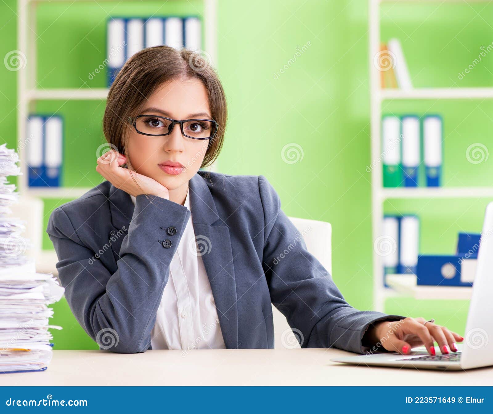 Young Female Employee Very Busy with Ongoing Paperwork Stock Image ...