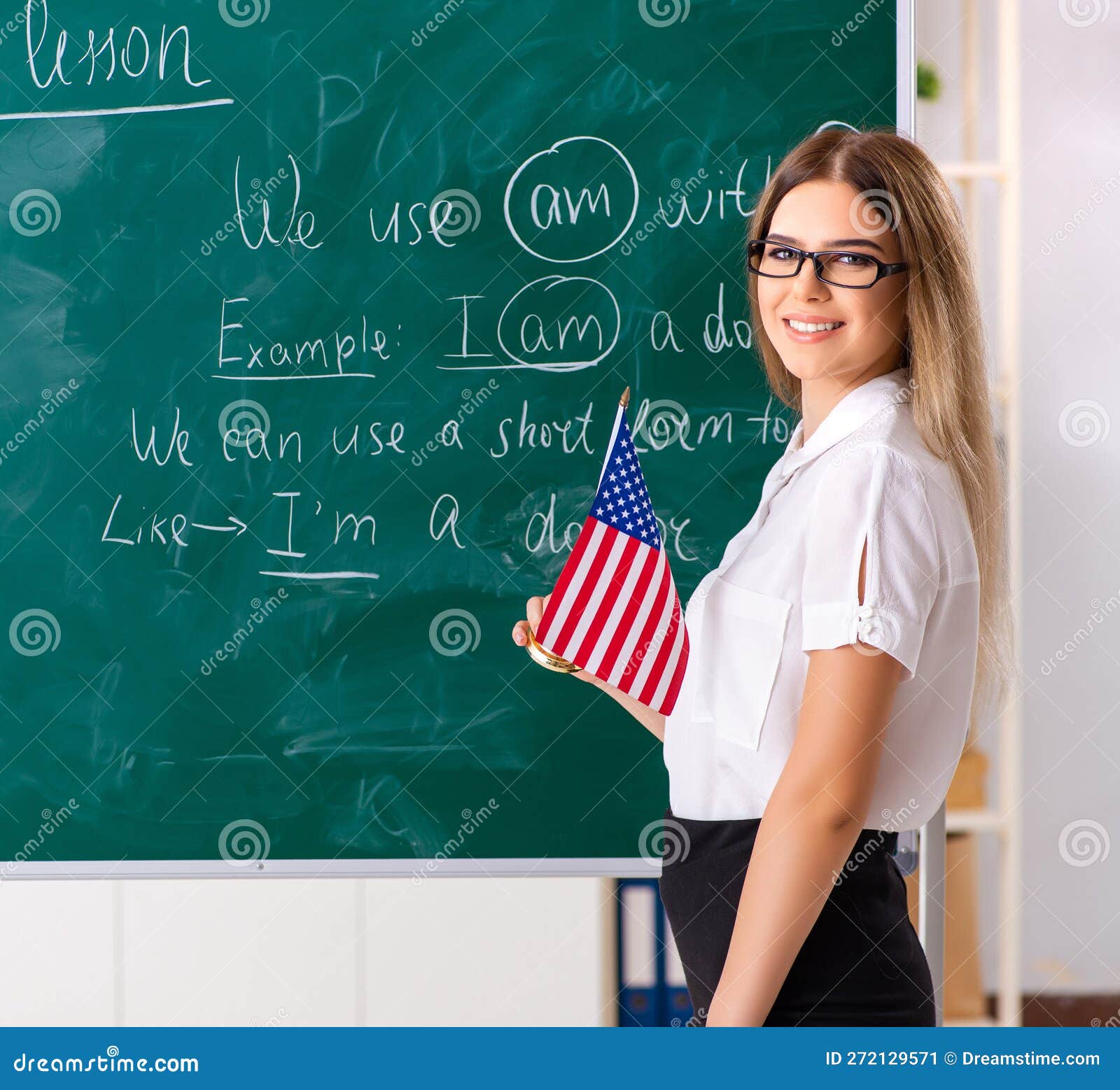 Young Female English Language Teacher Standing in Front of the B Stock ...