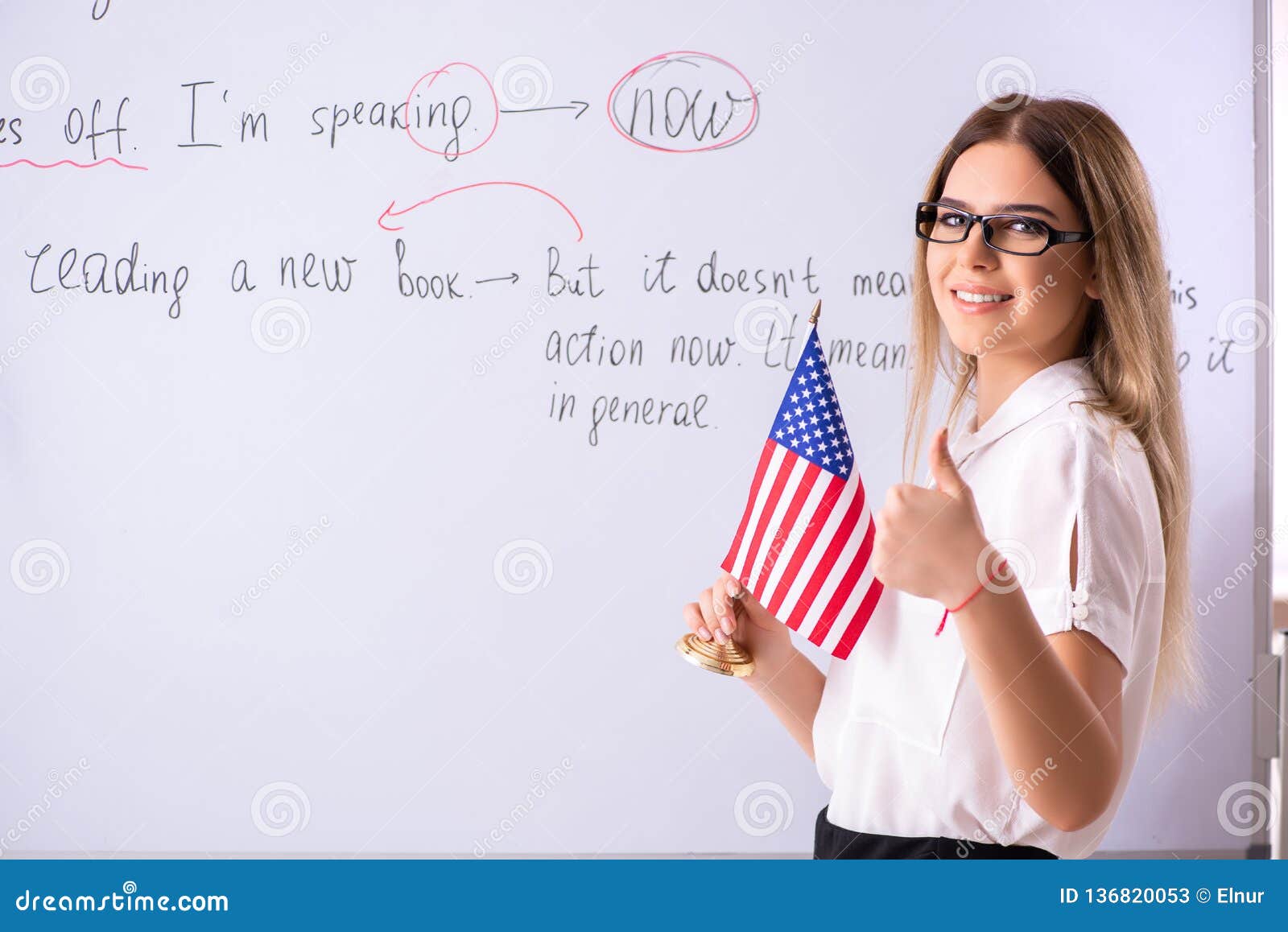 The Young Female English Language Teacher Standing in Front of the ... The Young Female English Language Teacher Standing in Front of the ...