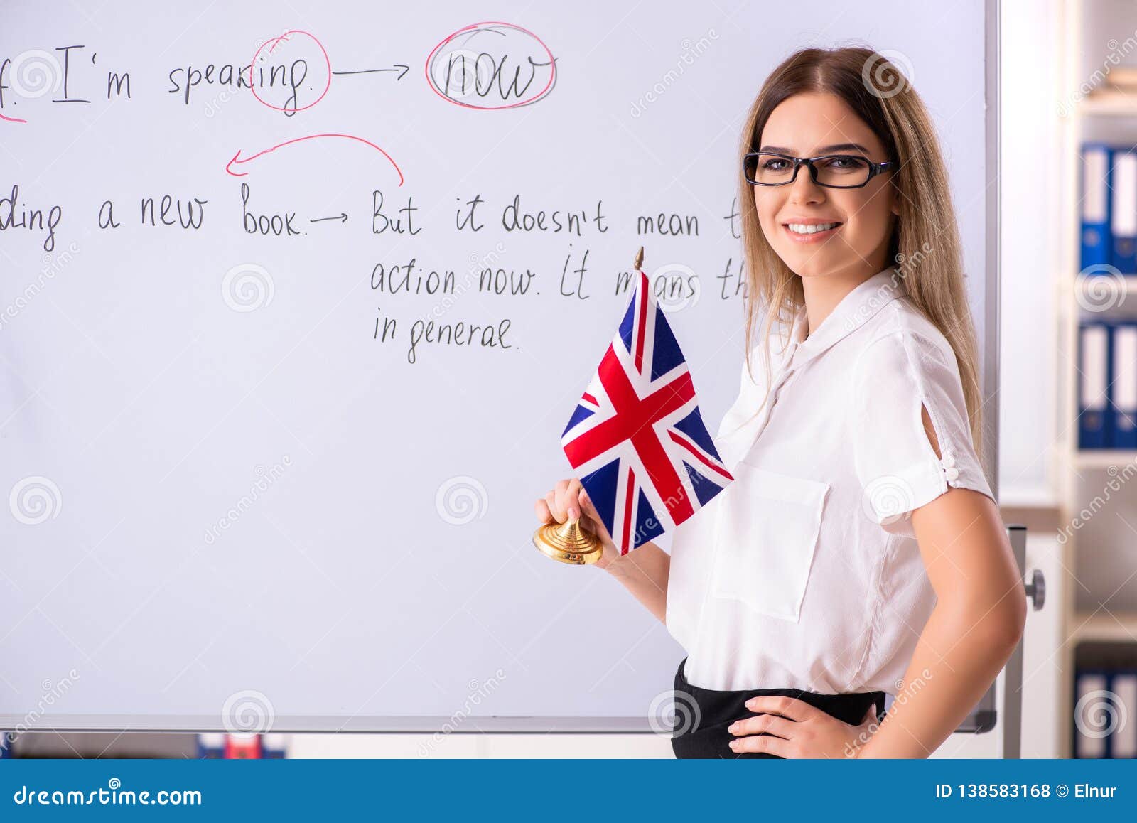 The Young Female English Language Teacher Standing in Front of the ... The Young Female English Language Teacher Standing in Front of the ...
