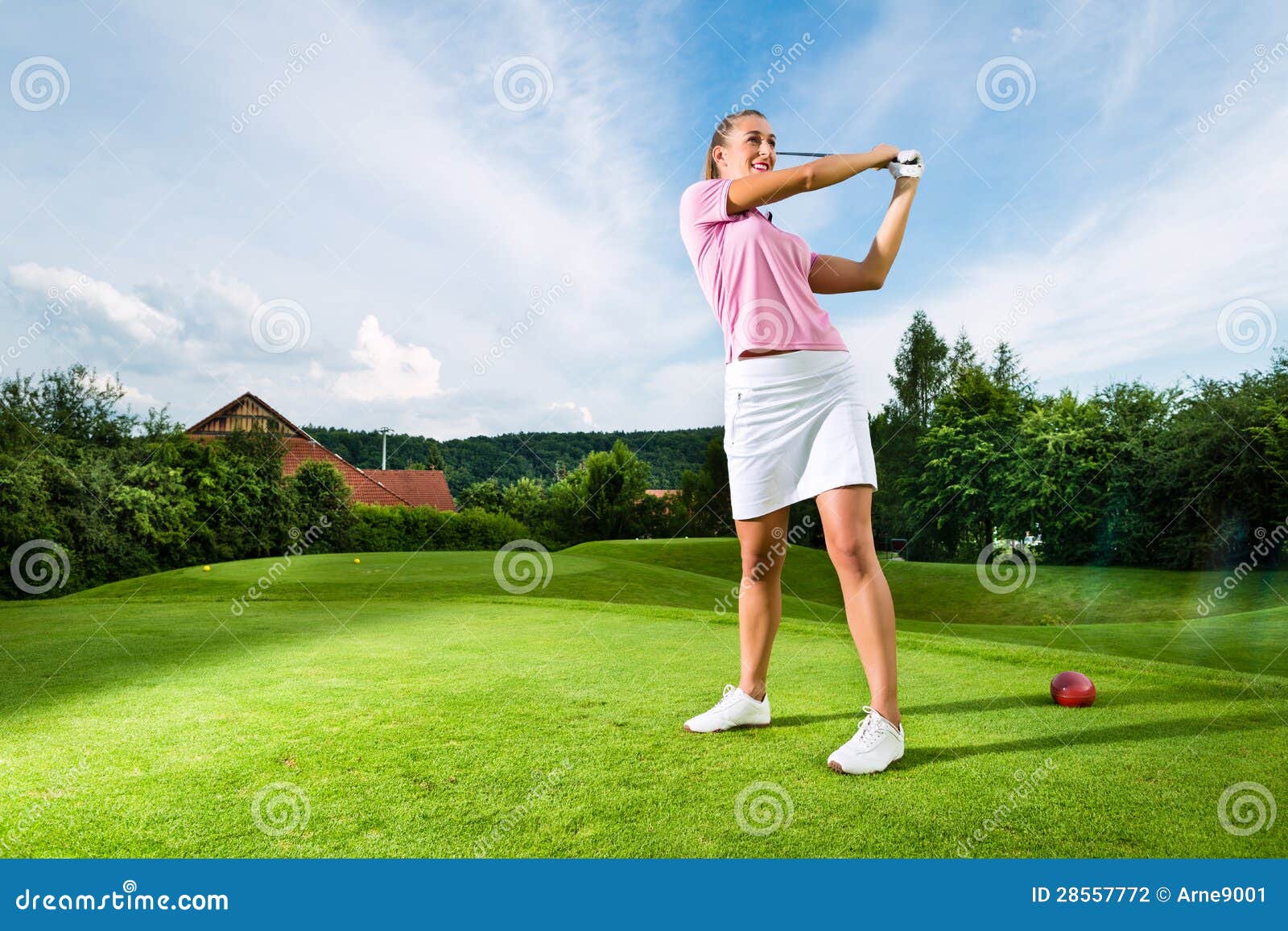 Young Female Golf Player on Course Doing Golf Swing Stock Photo - Image ...