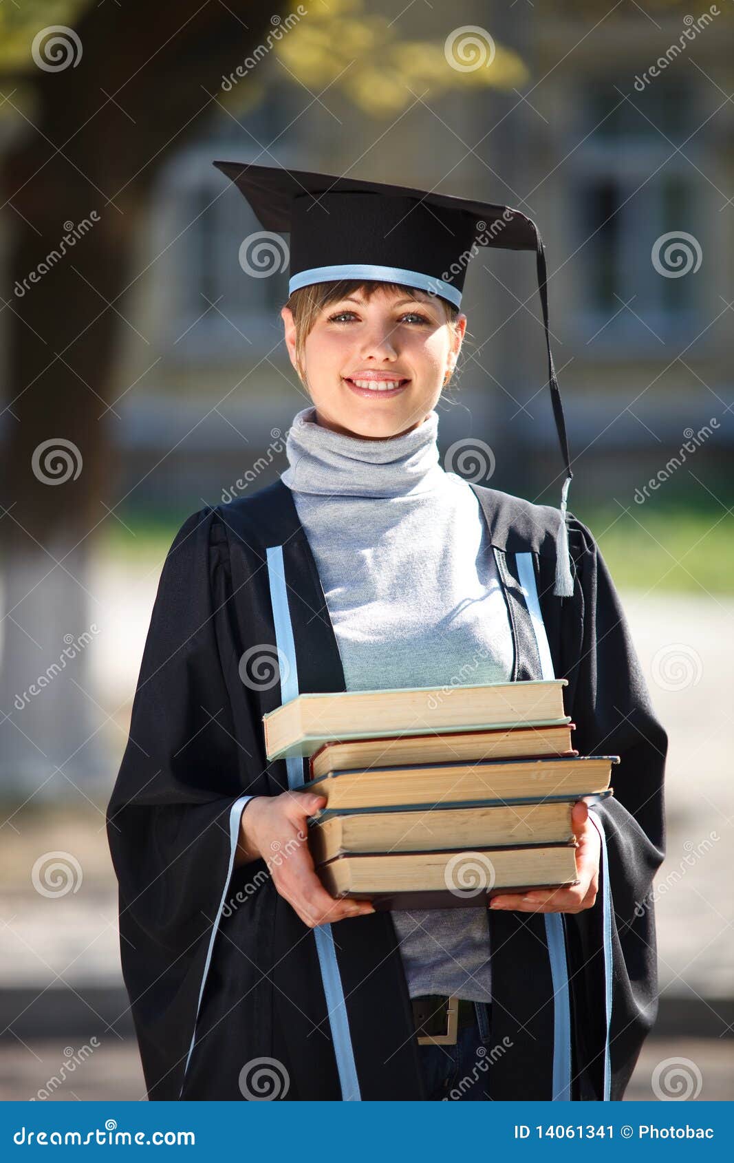 Young Female Graduate with a Stack of Books Stock Image - Image of ...