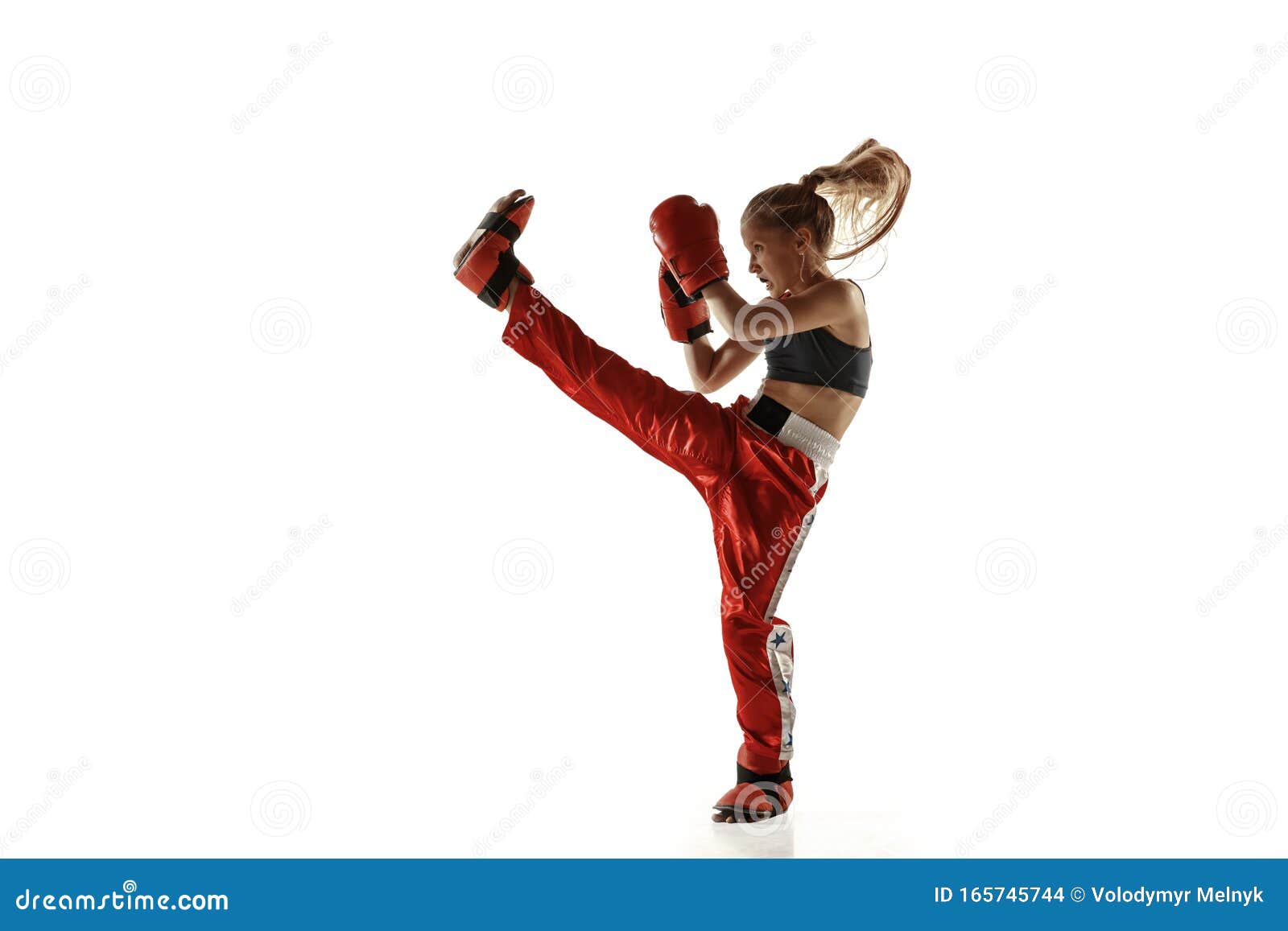 Young Female Kickboxing Fighter Training Isolated On White Background