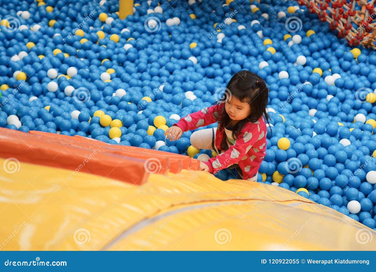 Kid Playing in the Ball Pit Stock Image - Image of colorful, texture ...
