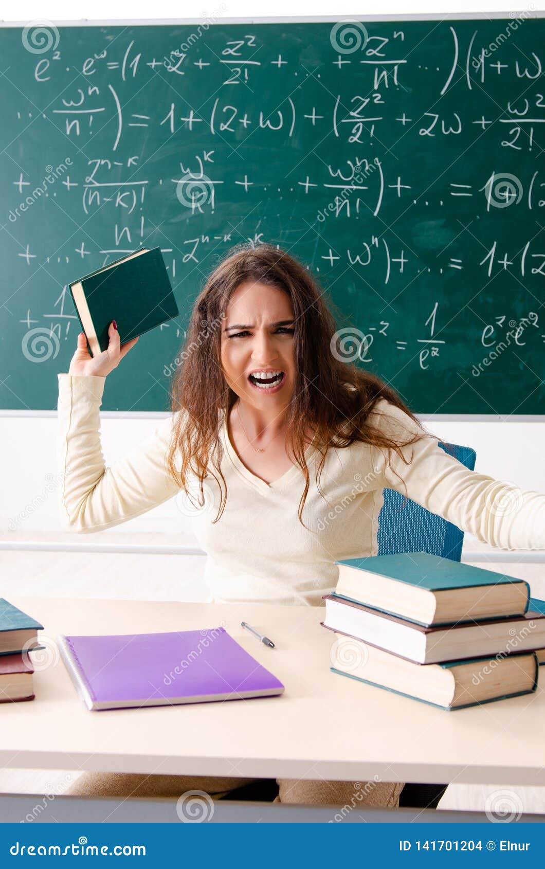 The Young Female Math Teacher in Front of Chalkboard Stock Photo ...