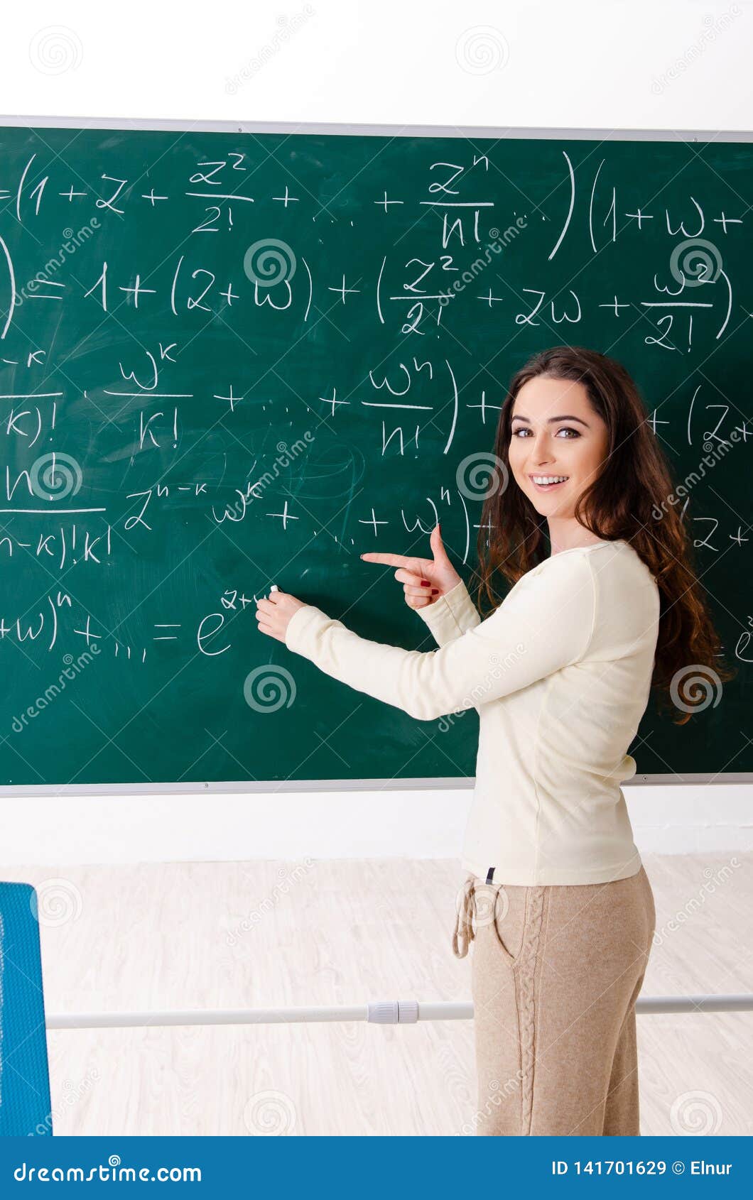 The Young Female Math Teacher in Front of Chalkboard Stock Image ...