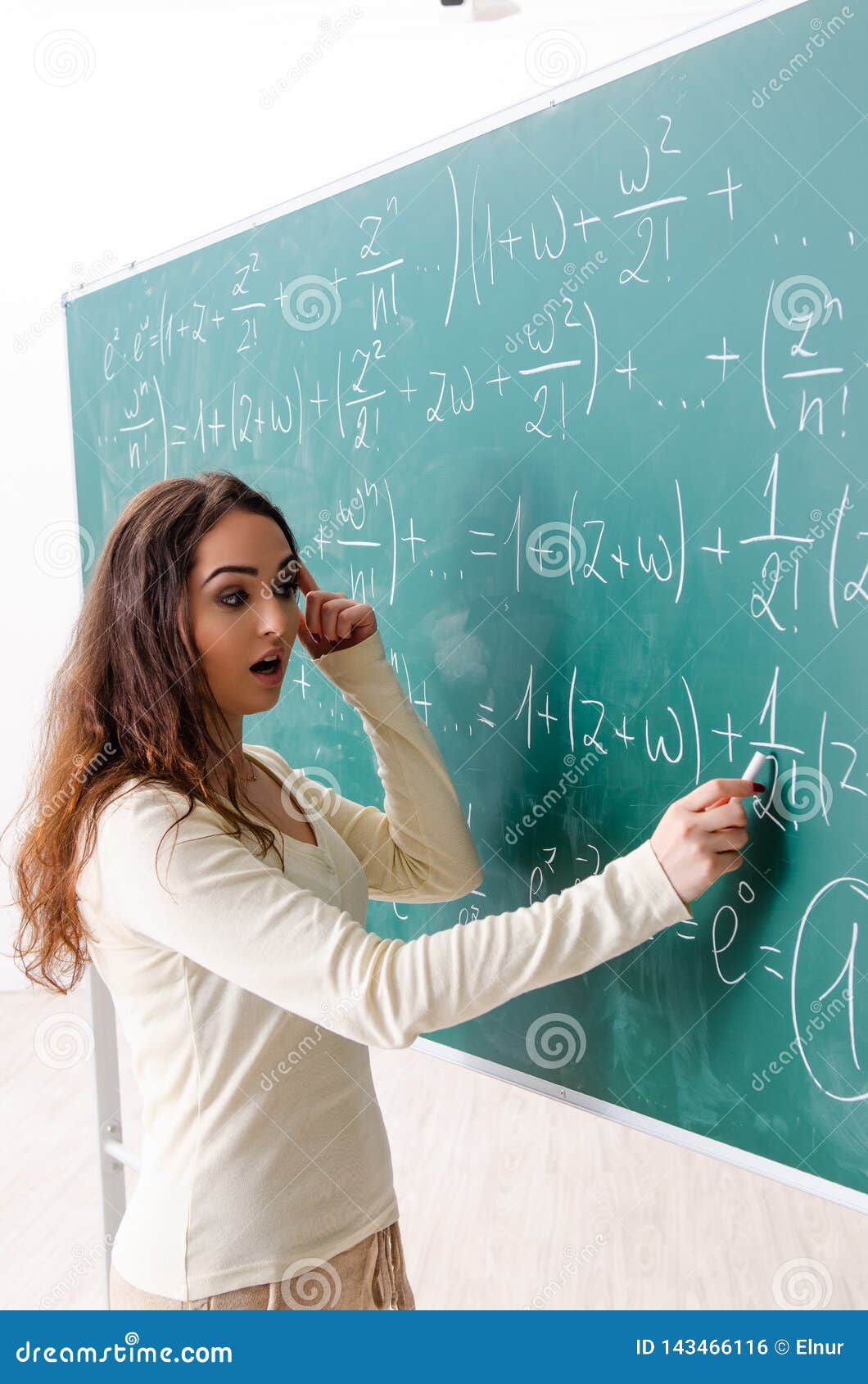 The Young Female Math Teacher in Front of Chalkboard Stock Photo ...