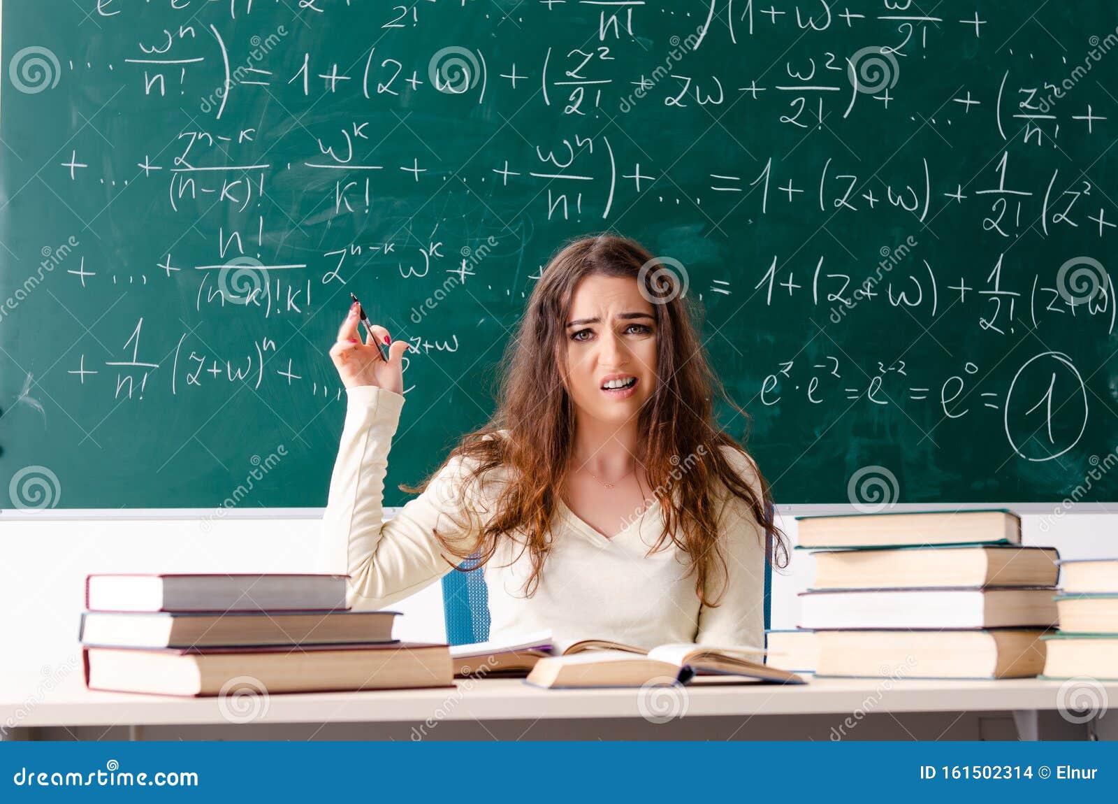 Young Female Math Teacher in Front of Chalkboard Stock Photo - Image of ...