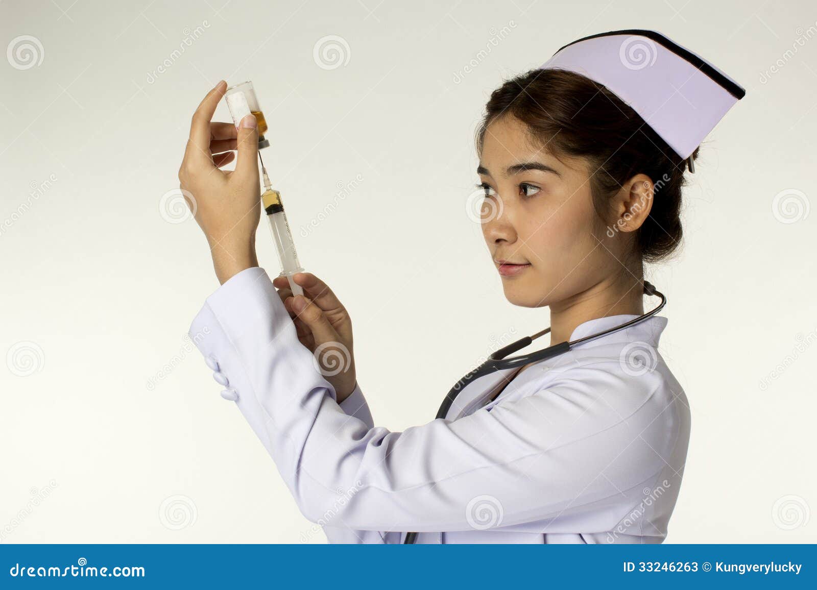 Young Female Nurse Holding Syringe Stock Image - Image of stethoscope ...