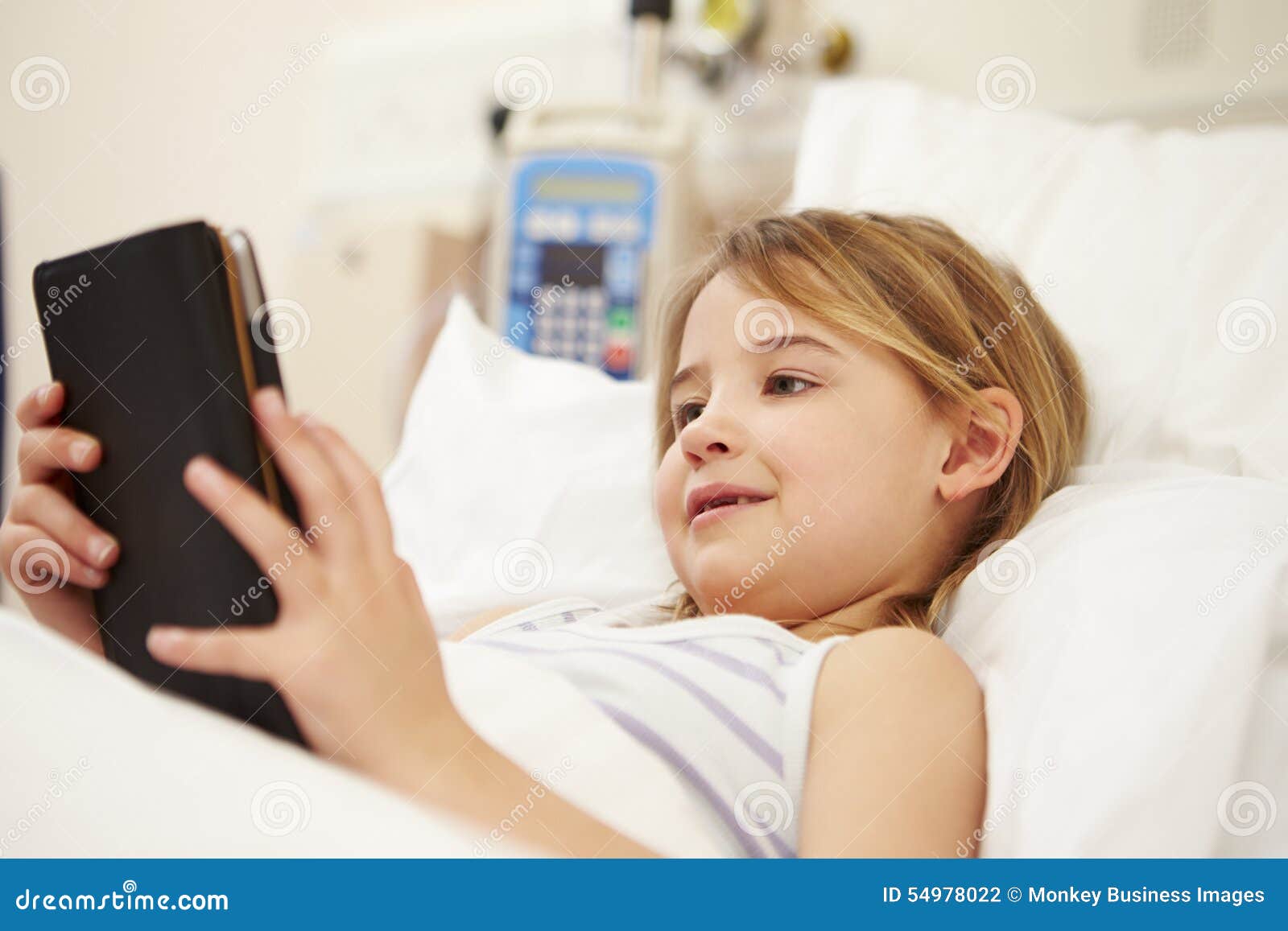 Young Female Patient Using Digital Tablet in Hospital Bed Stock Photo ...