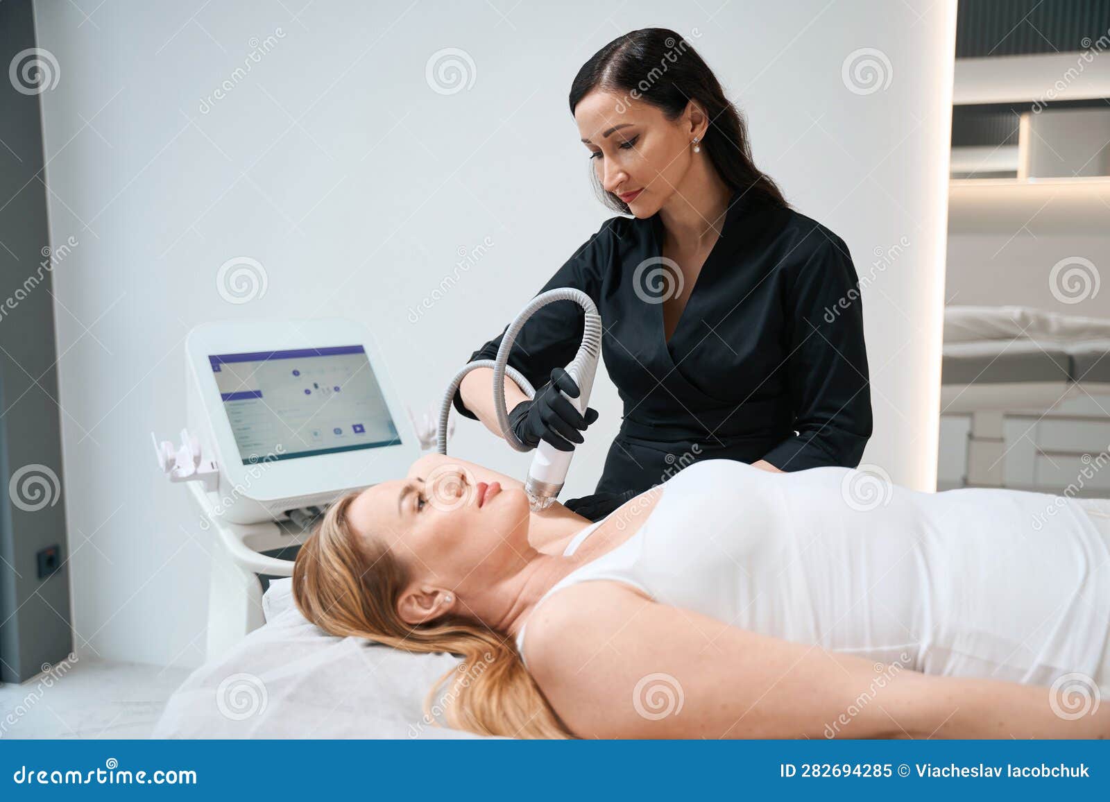 Young Female Performs Effective RF Lifting Procedure on Shoulder Area ...