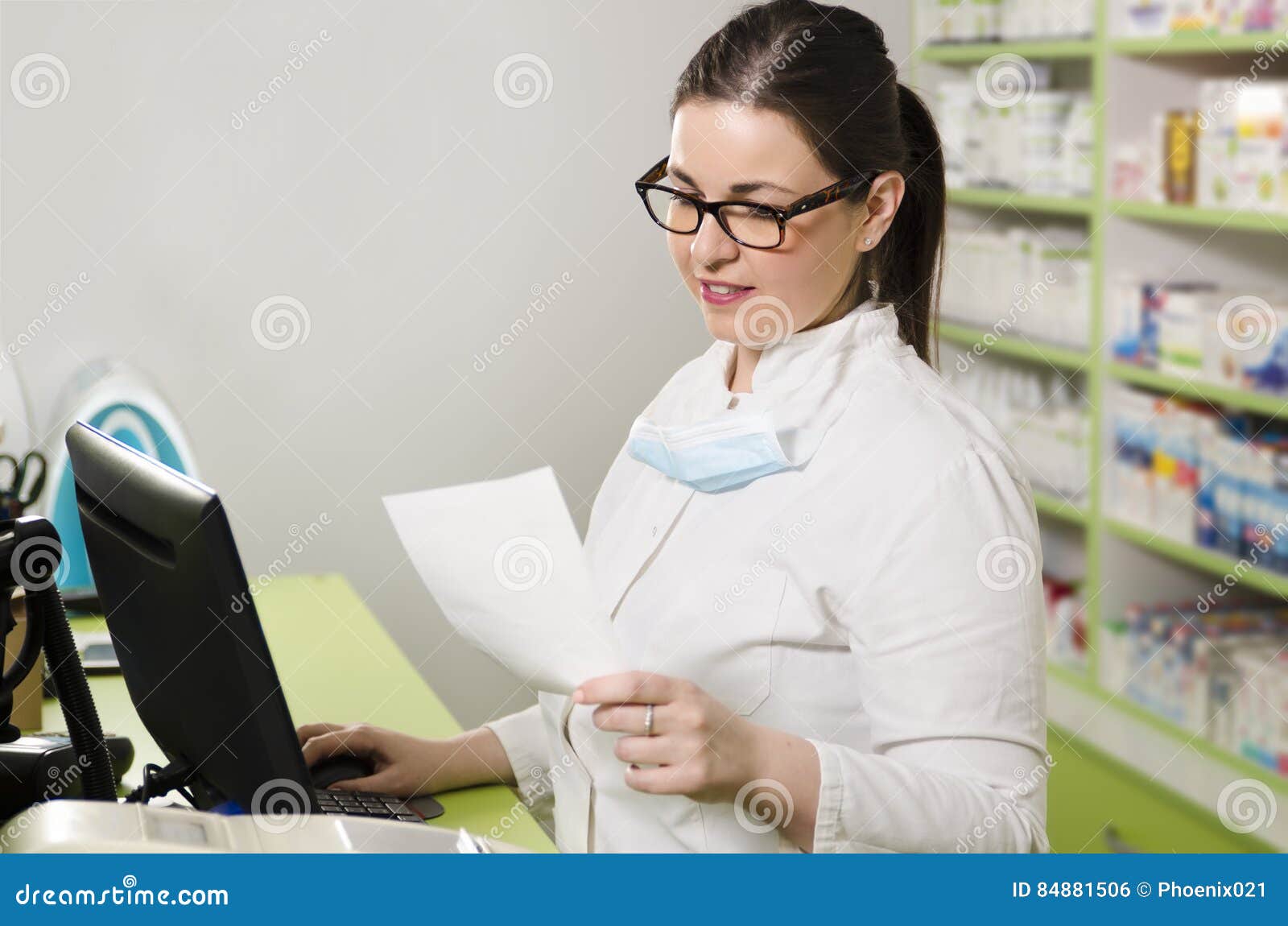Young Female Pharmacist Working on Computer Stock Photo - Image of ...