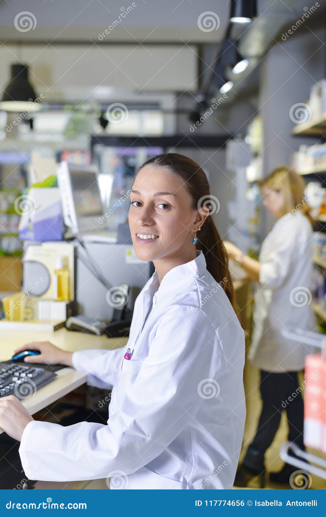 View of an Attractive Pharmacist at Work Stock Photo - Image of desk ...