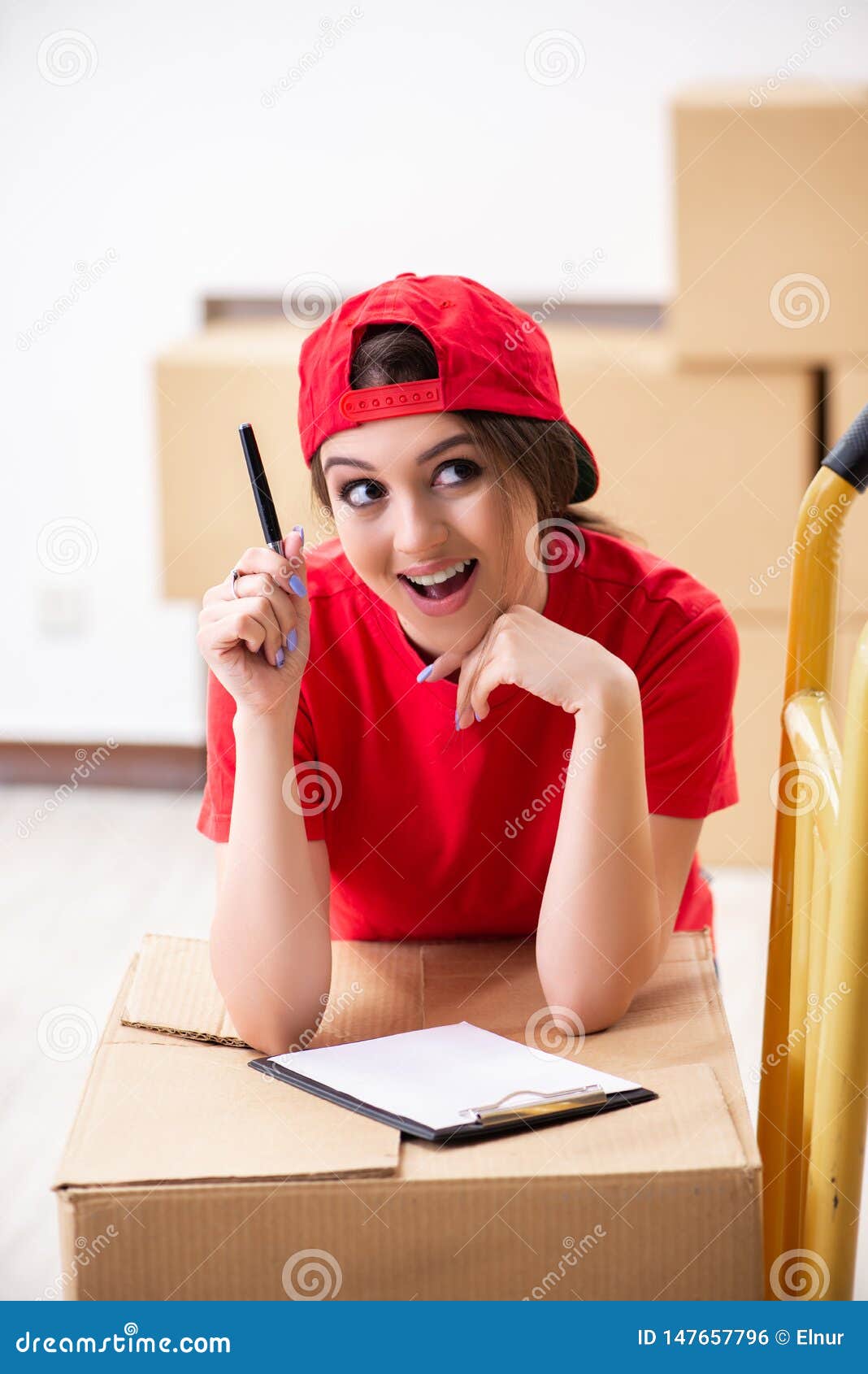 The Young Female Professional Mover Doing Home Relocation Stock Photo ...