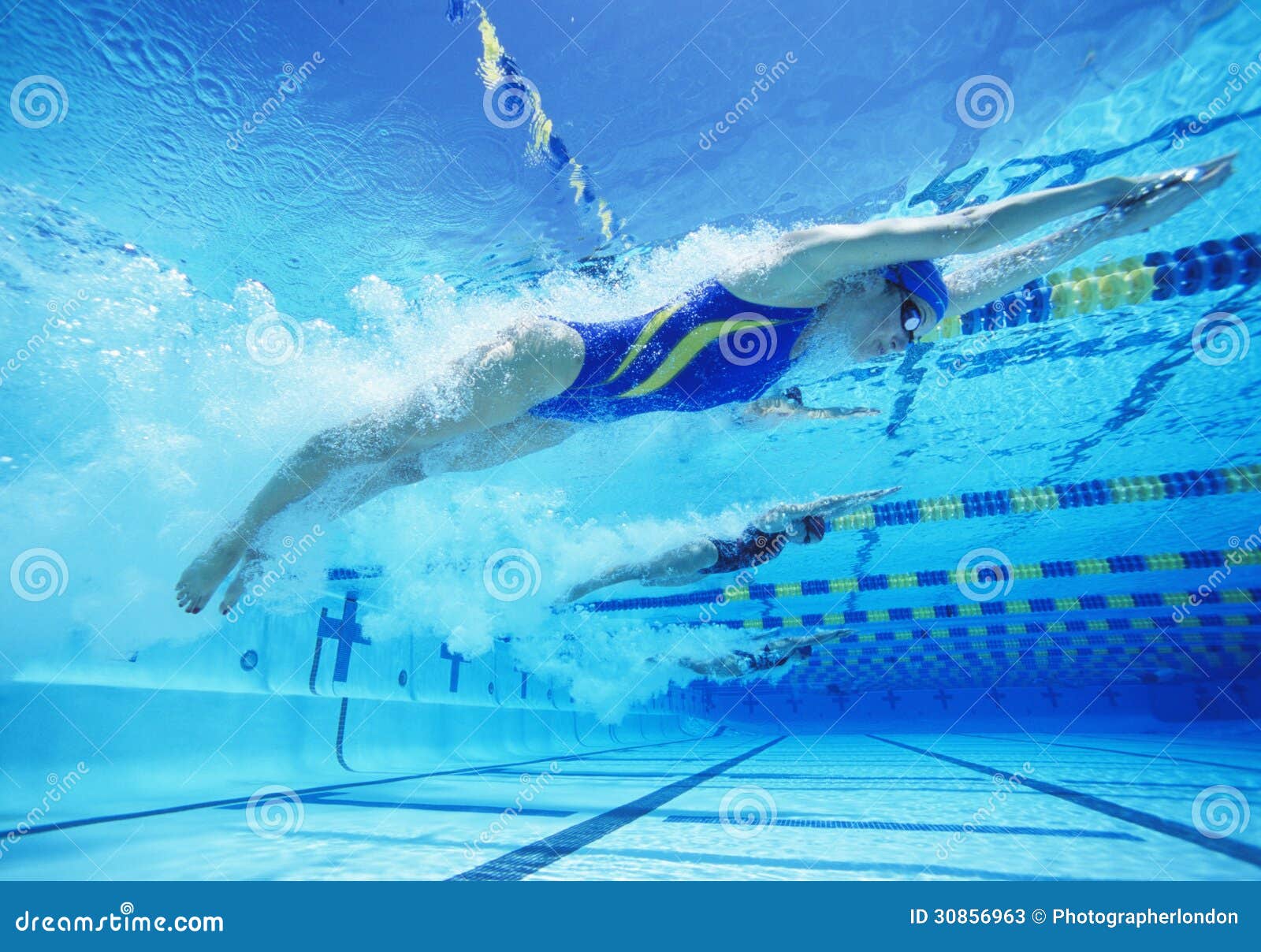 Young Female Professional Participants Racing in Pool Stock Image ...