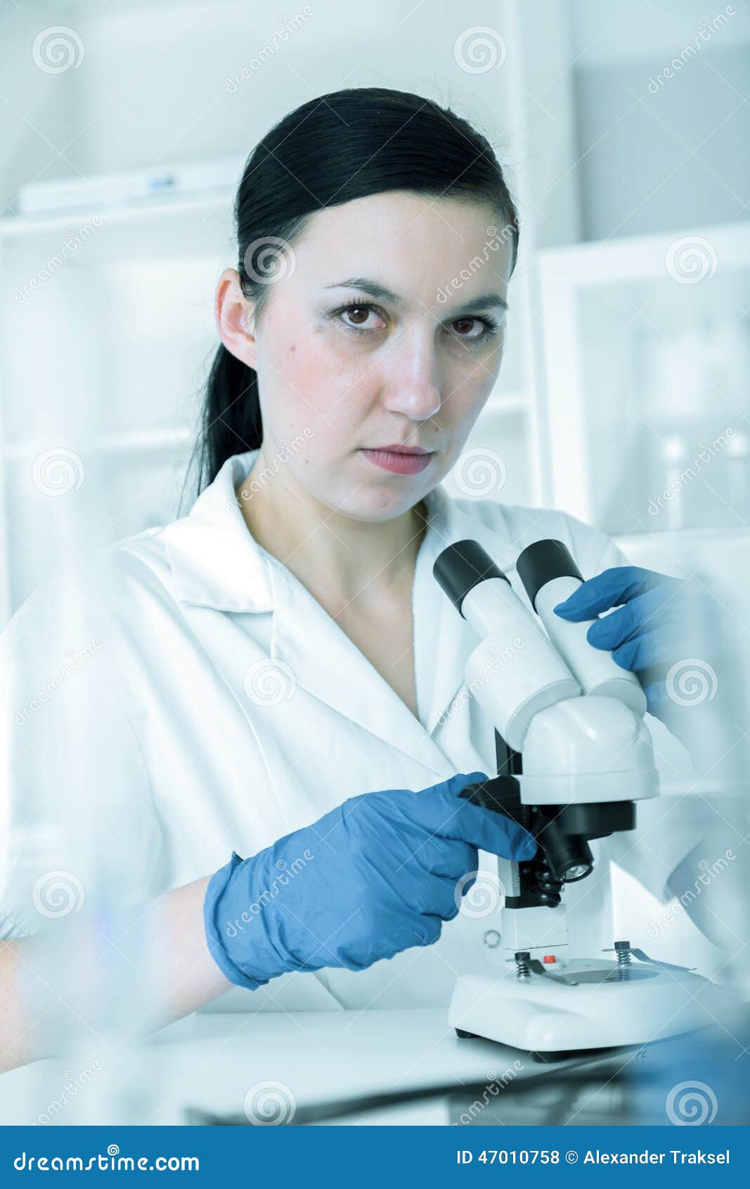 Young Female Researcher Using Microscope Stock Photo - Image of ...