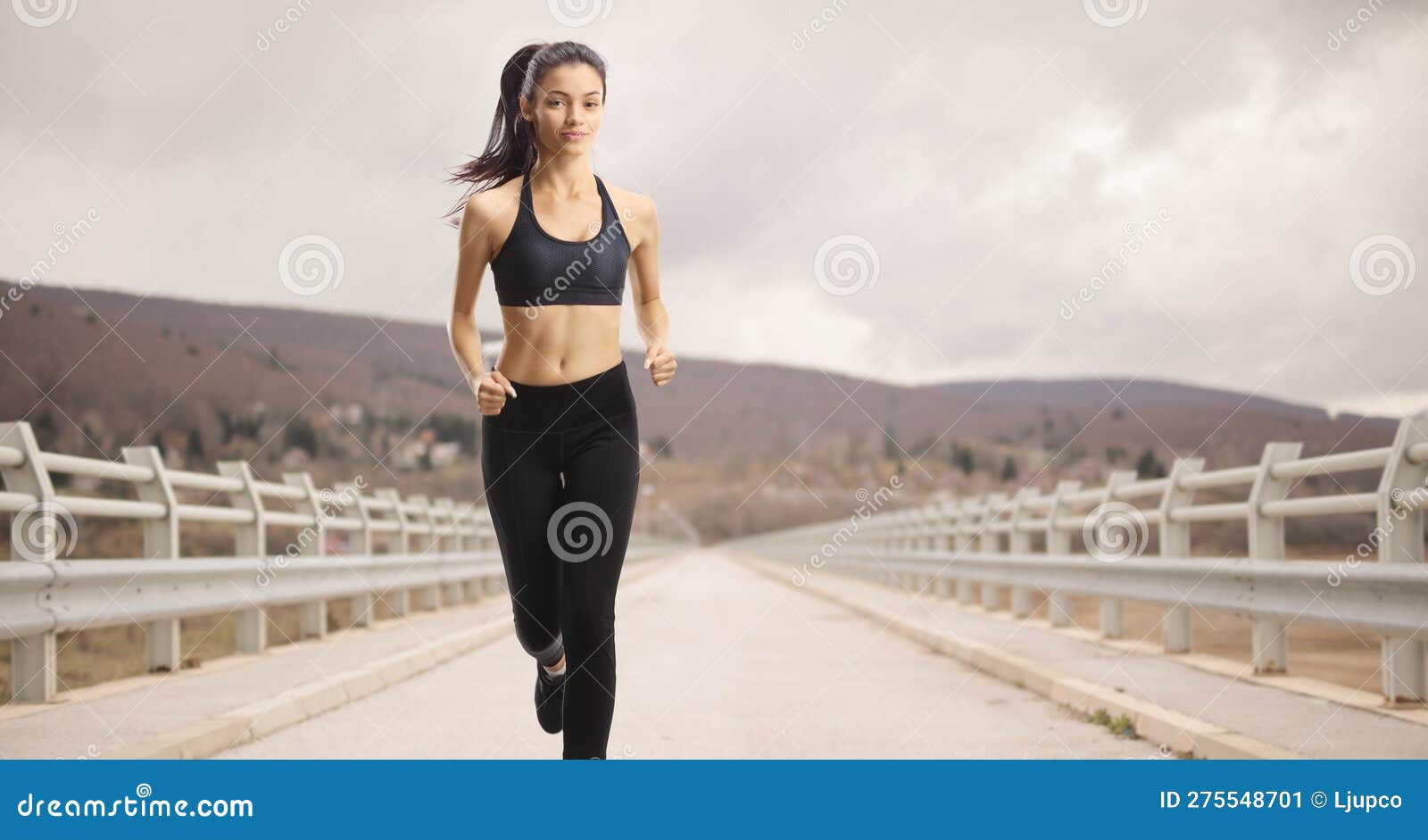 Young Female Jogging on a Bridge Stock Image - Image of sportswear ...